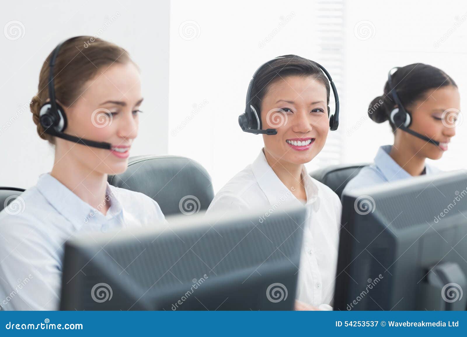 Business People with Headsets Smiling at Camera Stock Image - Image of ...