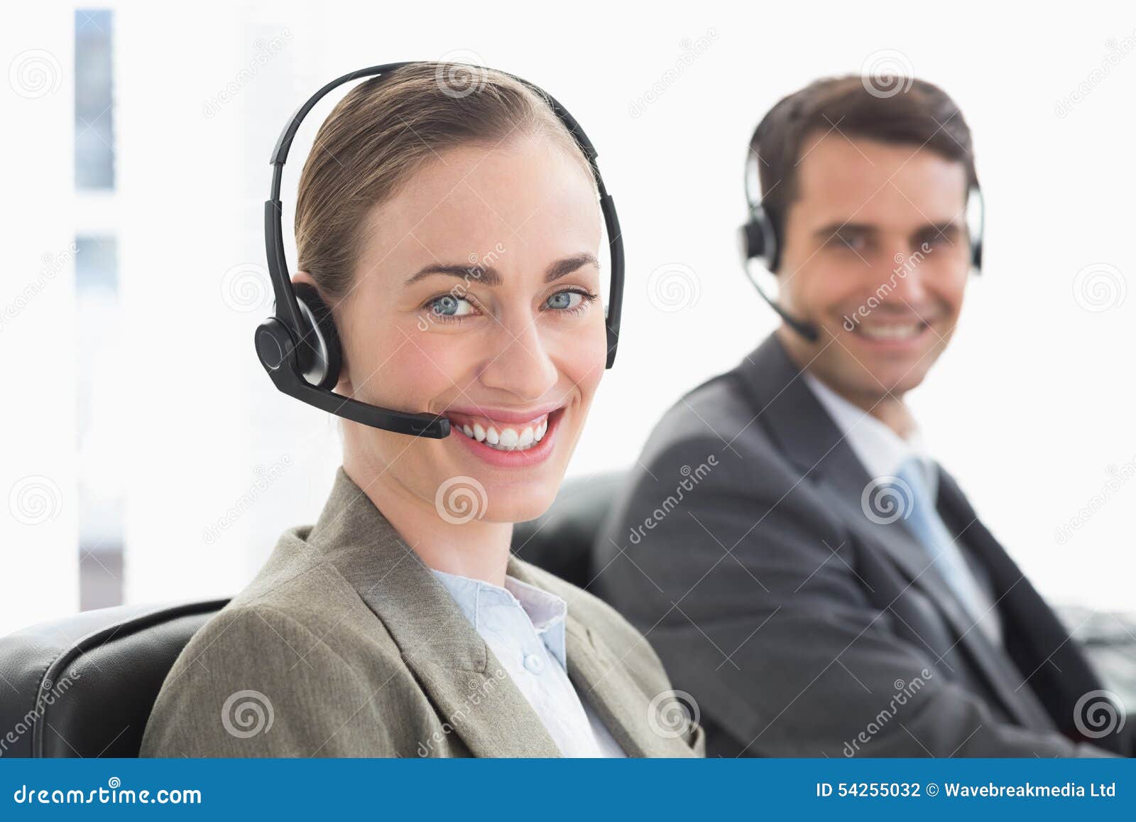 Business People with Headsets Smiling at Camera Stock Photo - Image of ...