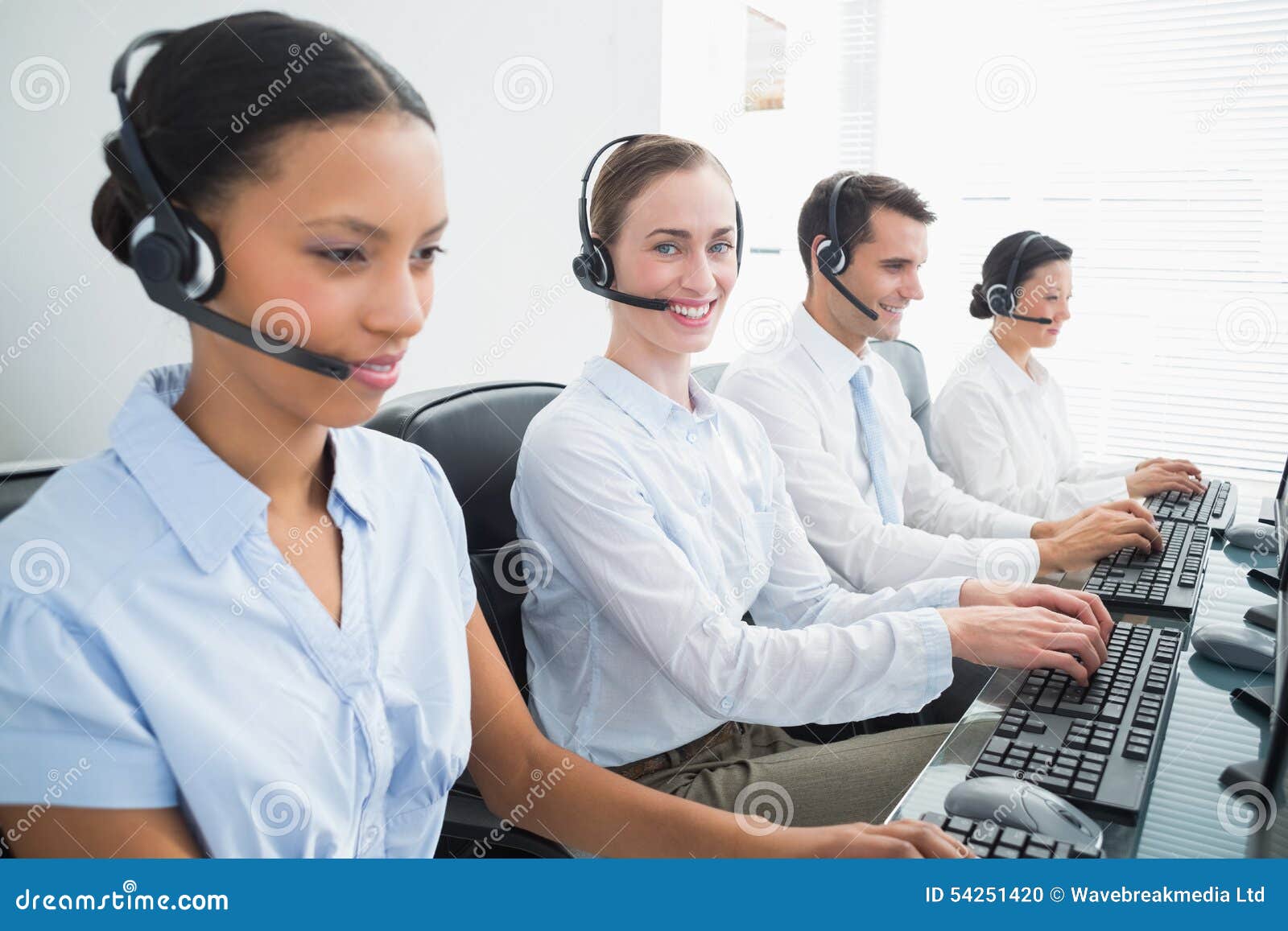 Business People with Headsets Using Computers Stock Photo - Image of ...
