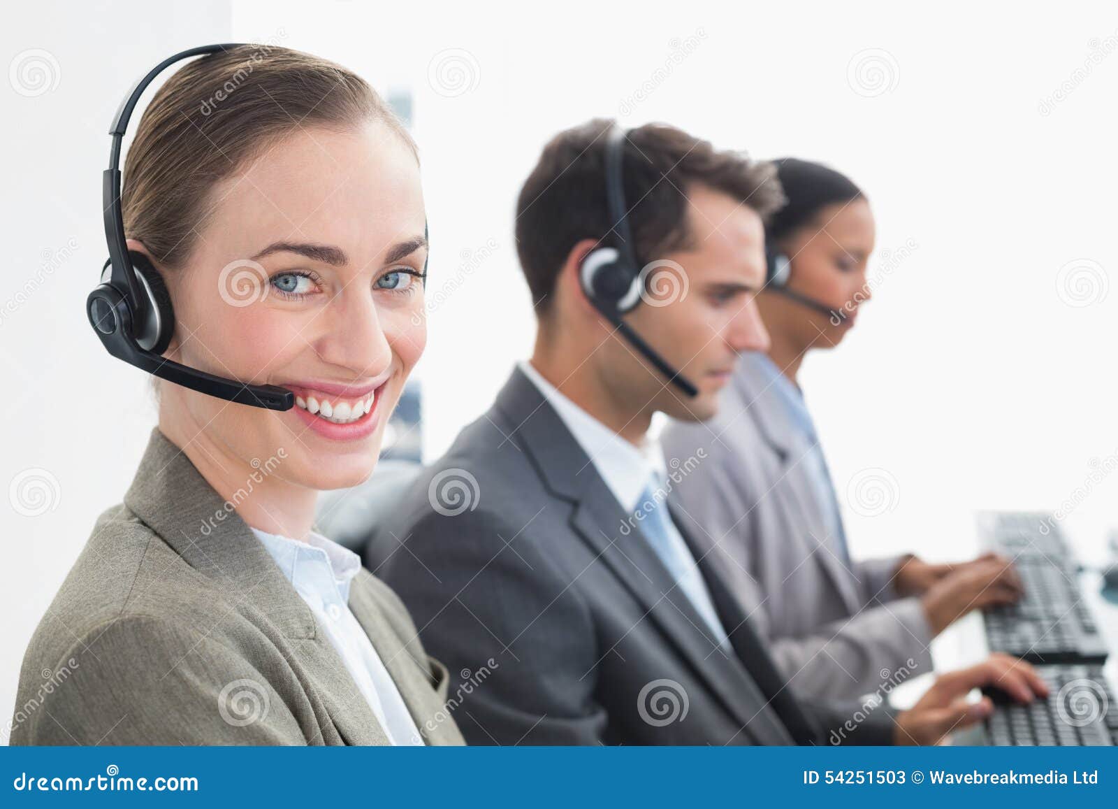 Business People with Headsets Using Computers Stock Image - Image of ...