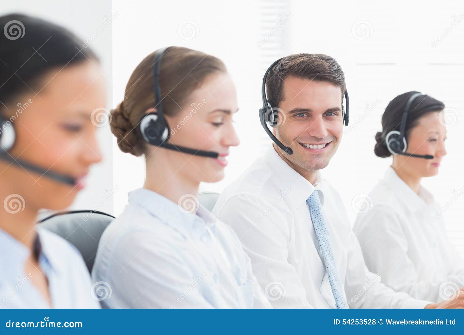 Business People with Headsets Using Computers Stock Photo - Image of ...