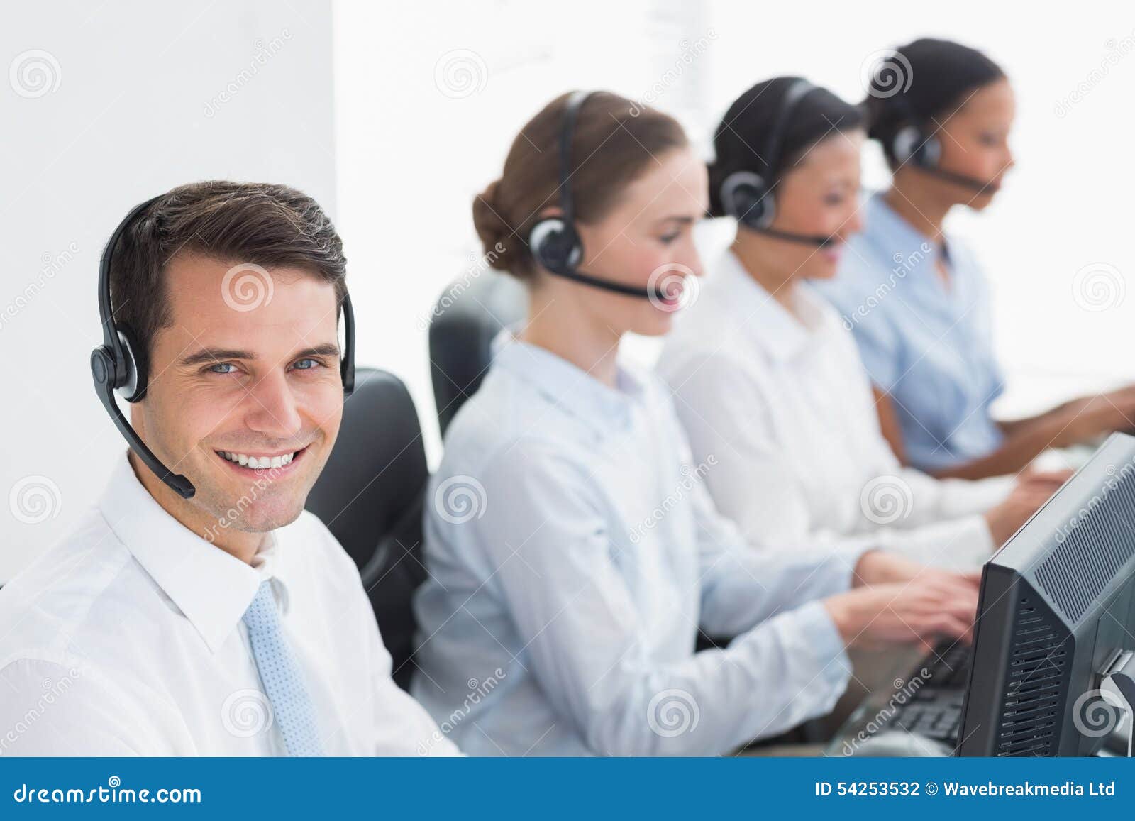 Business People with Headsets Using Computers Stock Photo - Image of ...
