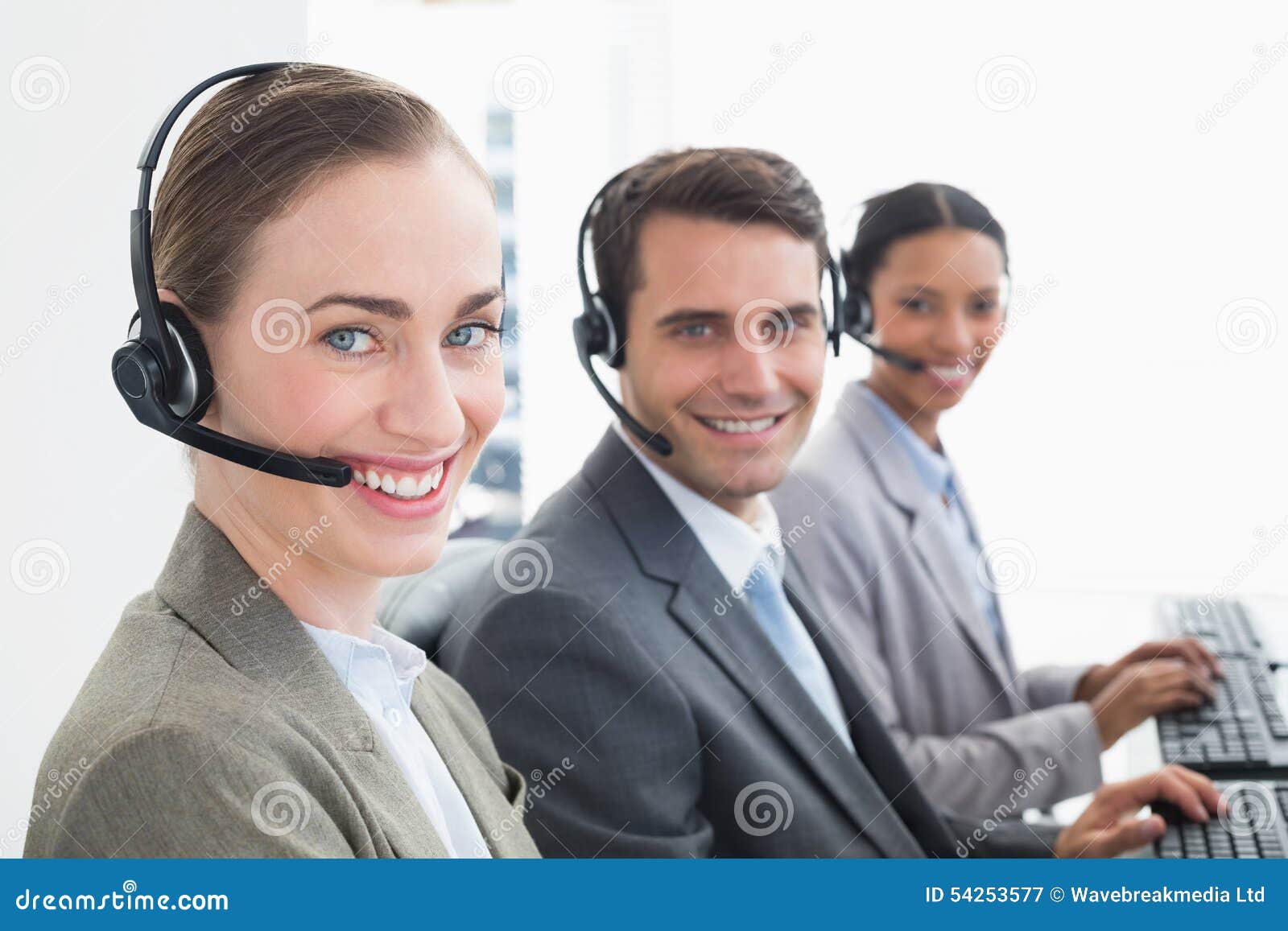 Business People with Headsets Using Computers Stock Image - Image of ...