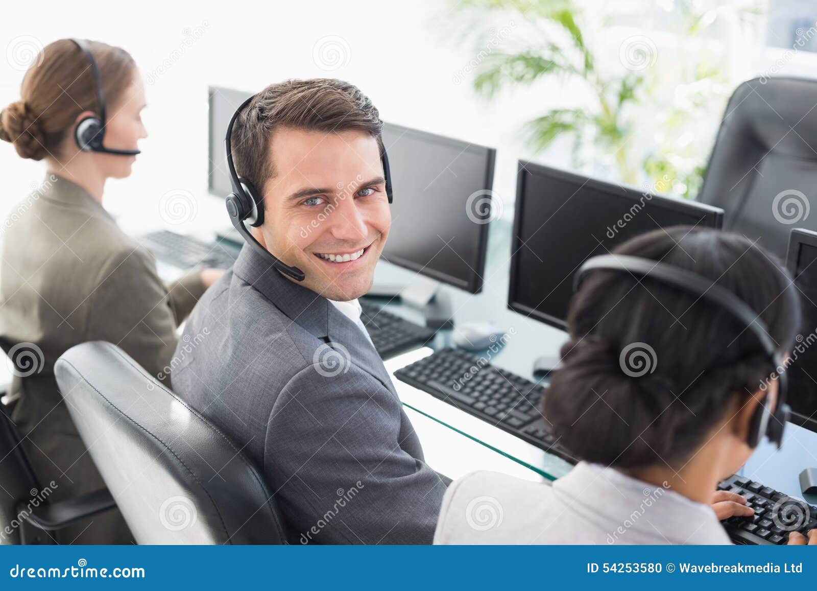 Business People with Headsets Using Computers Stock Photo - Image of ...