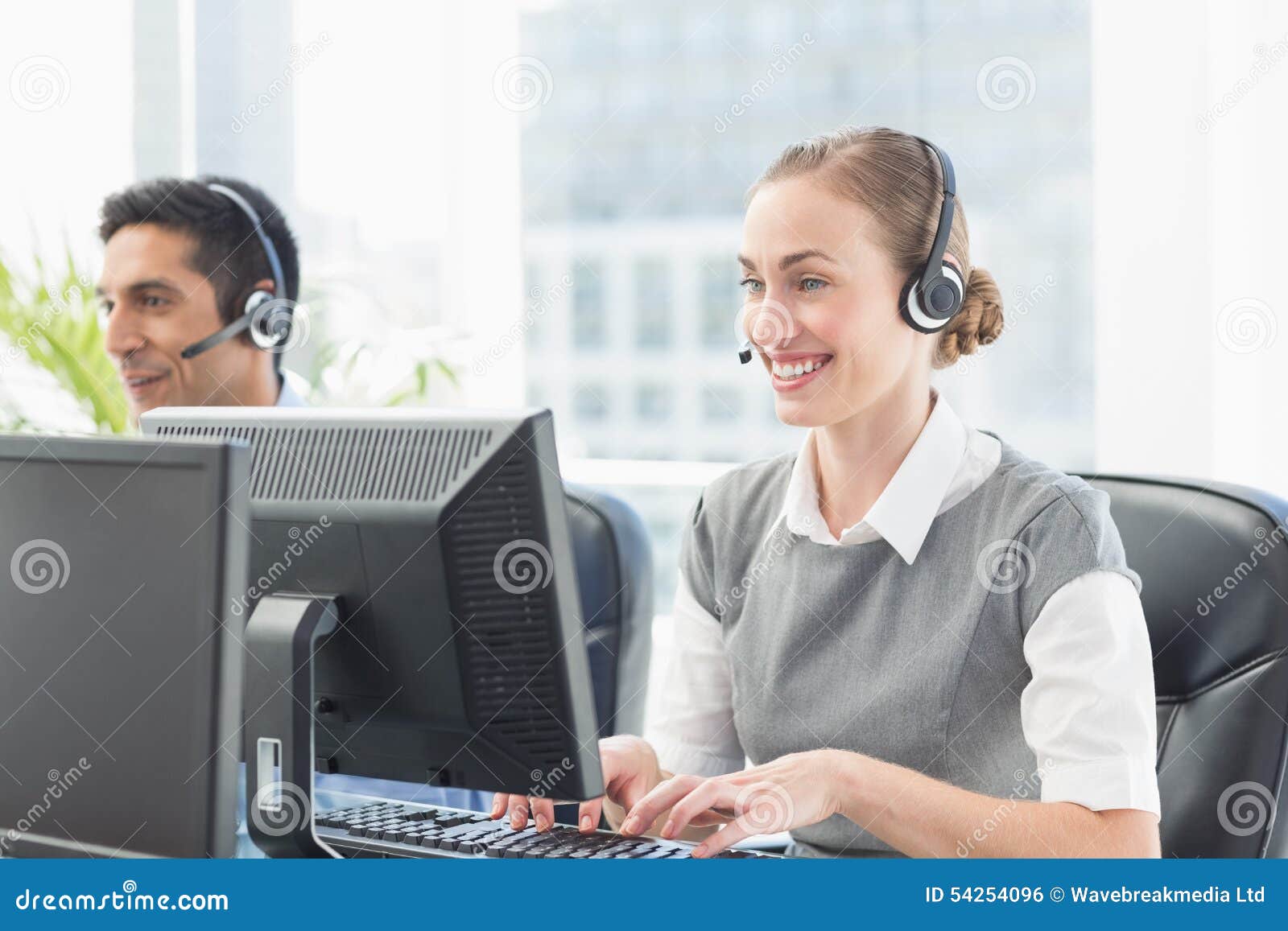 Business People with Headsets Using Computers Stock Photo - Image of ...