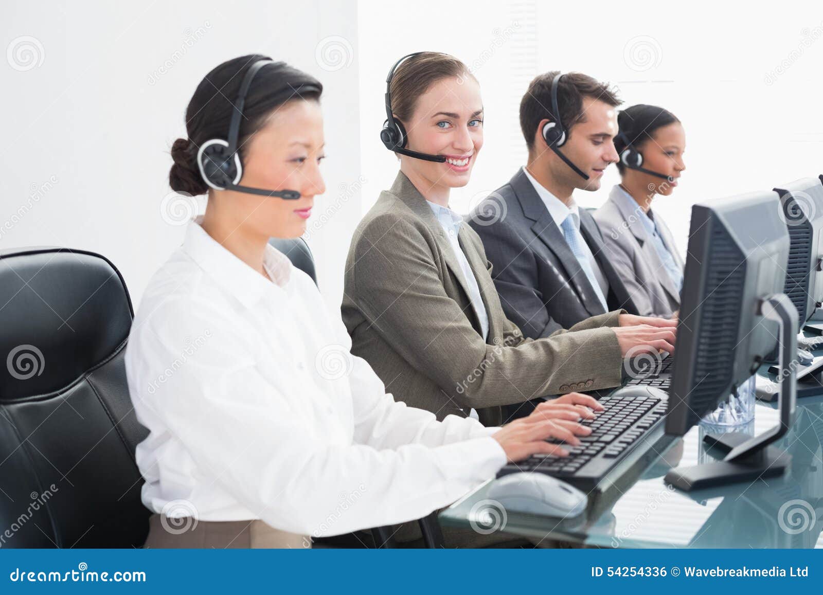 Business People with Headsets Using Computers Stock Photo - Image of ...
