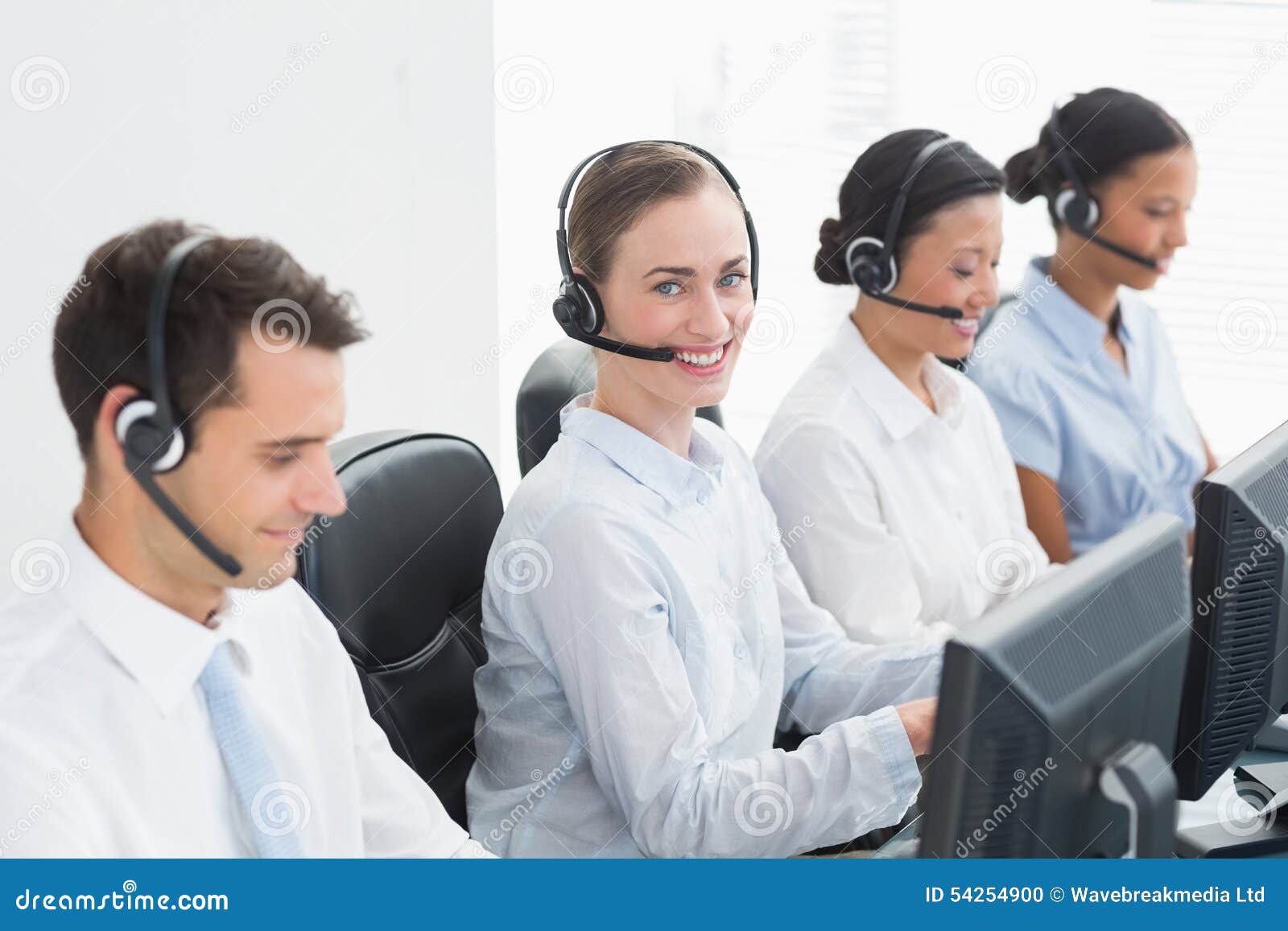 Business People with Headsets Using Computers Stock Photo - Image of ...