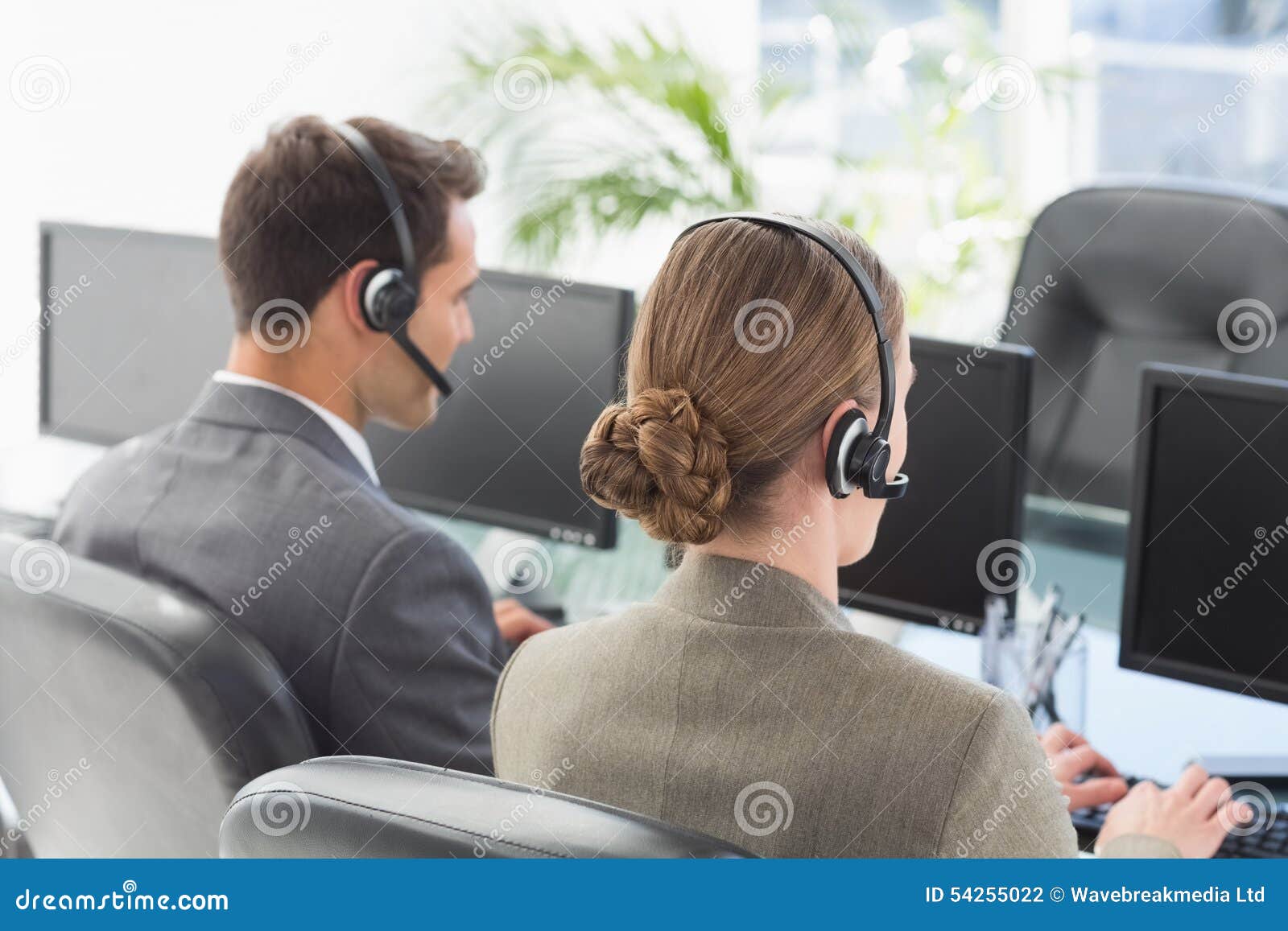Business People with Headsets Using Computers Stock Photo - Image of ...