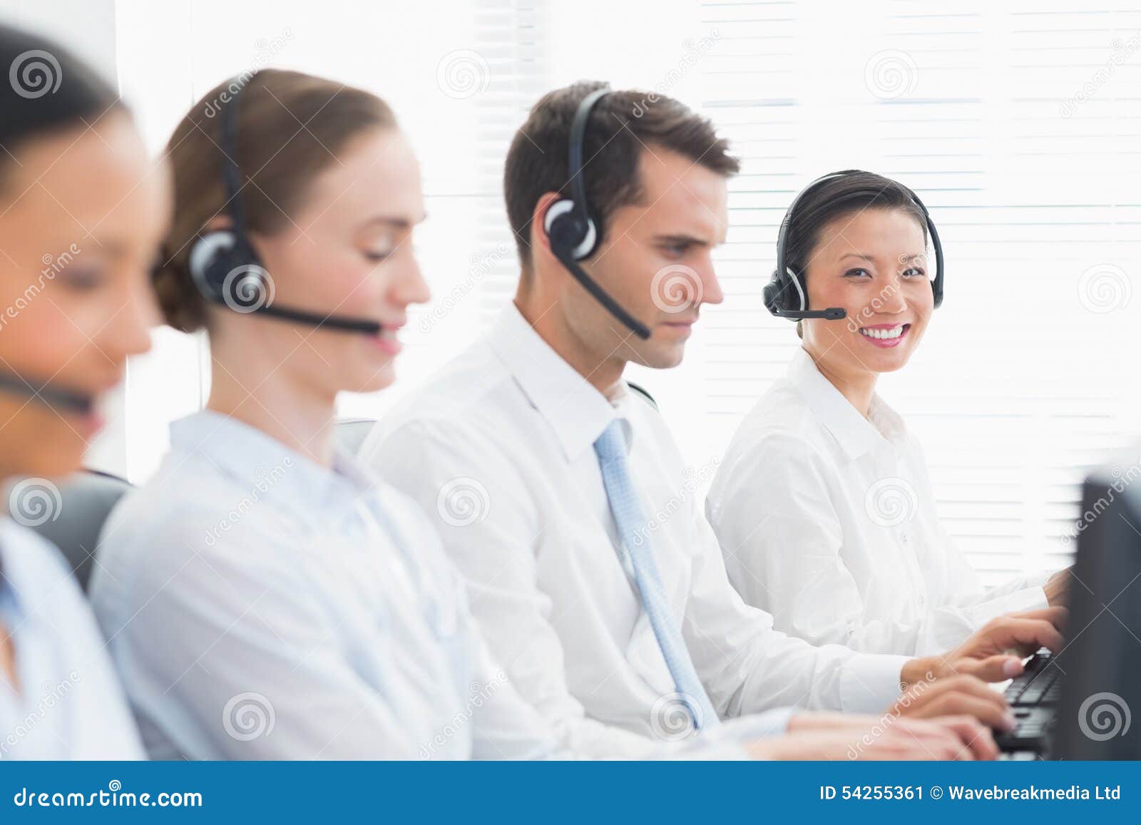 Business People with Headsets Using Computers Stock Image - Image of ...