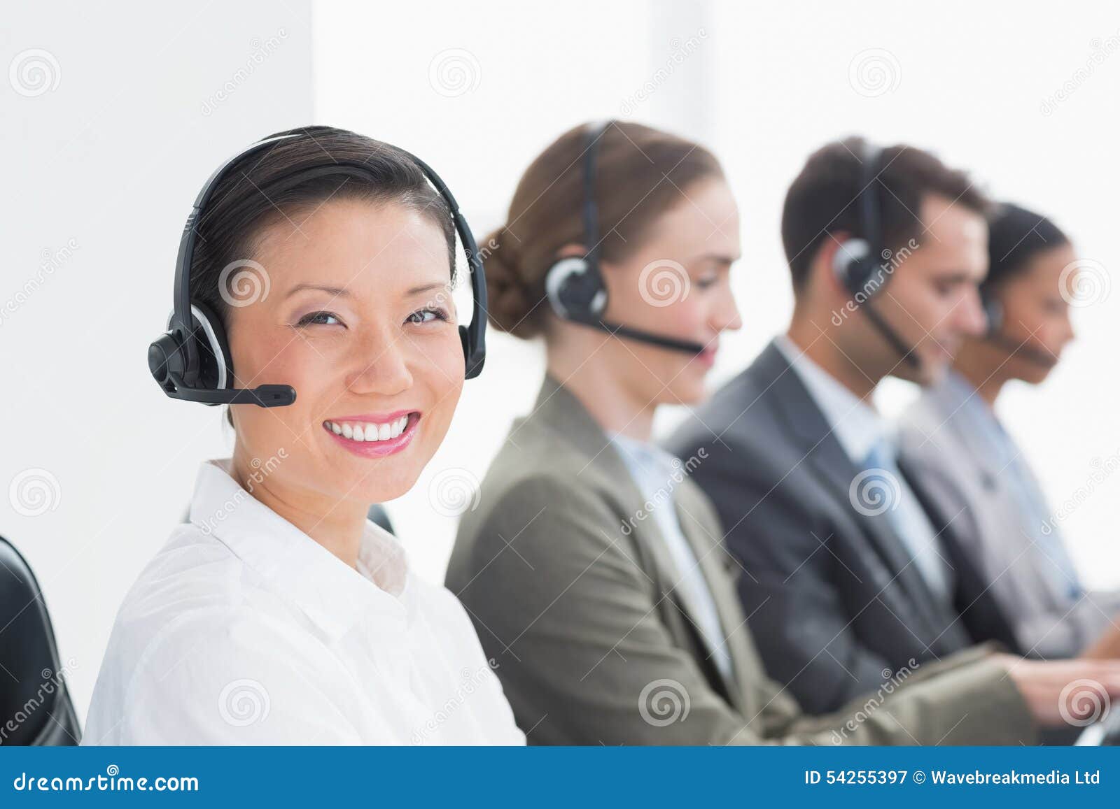 Business People with Headsets Using Computers Stock Image - Image of ...