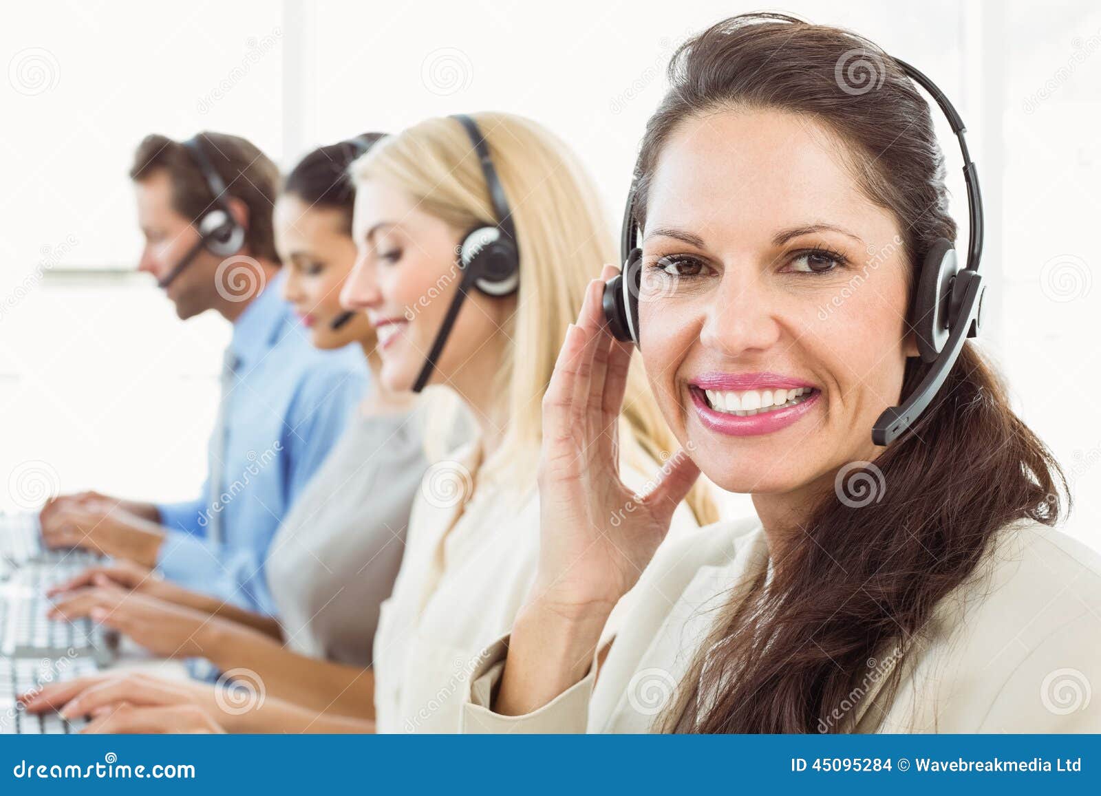 Business People with Headsets Using Computers in Office Stock Photo ...