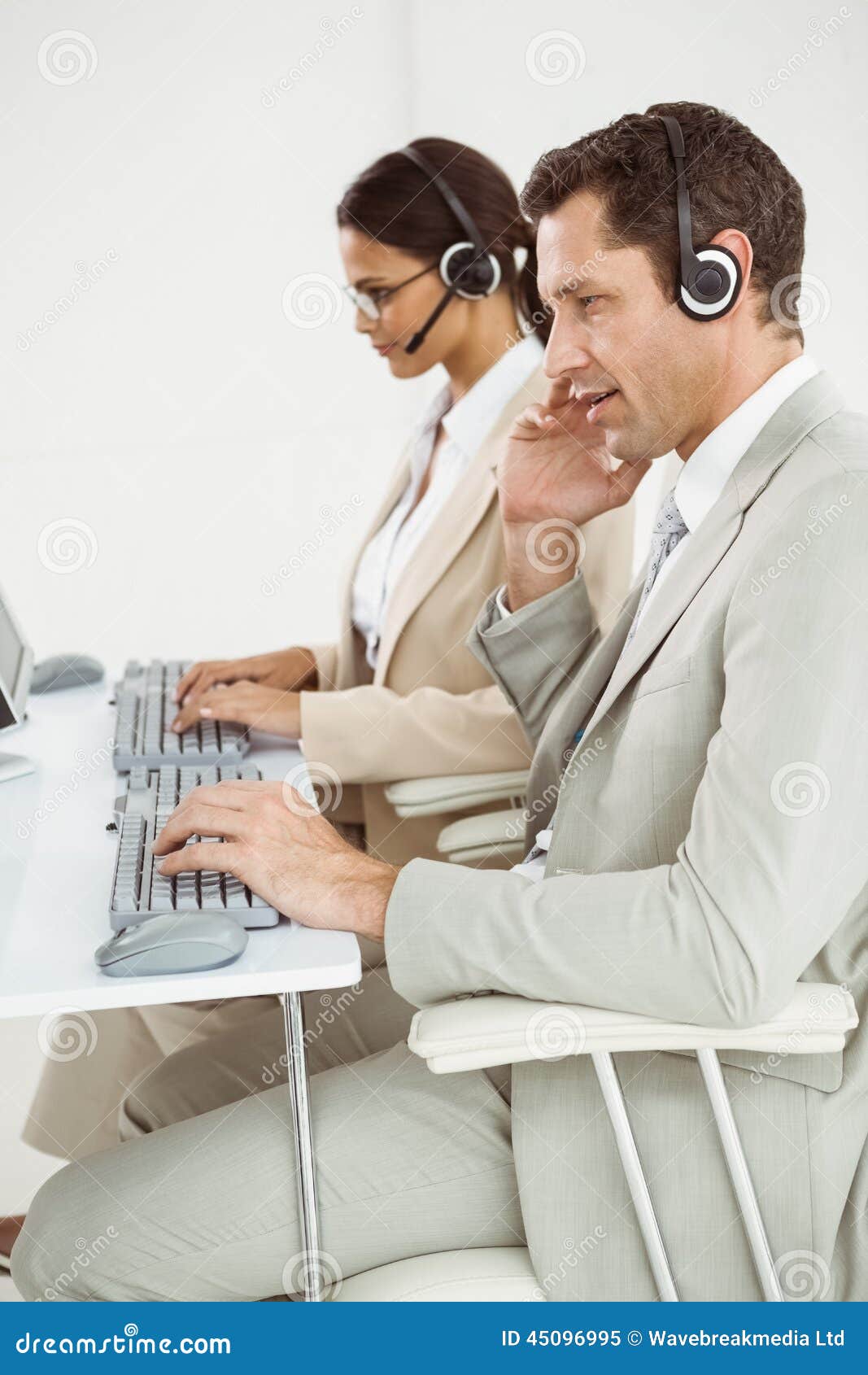 Business People with Headsets Using Computers Stock Image - Image of ...