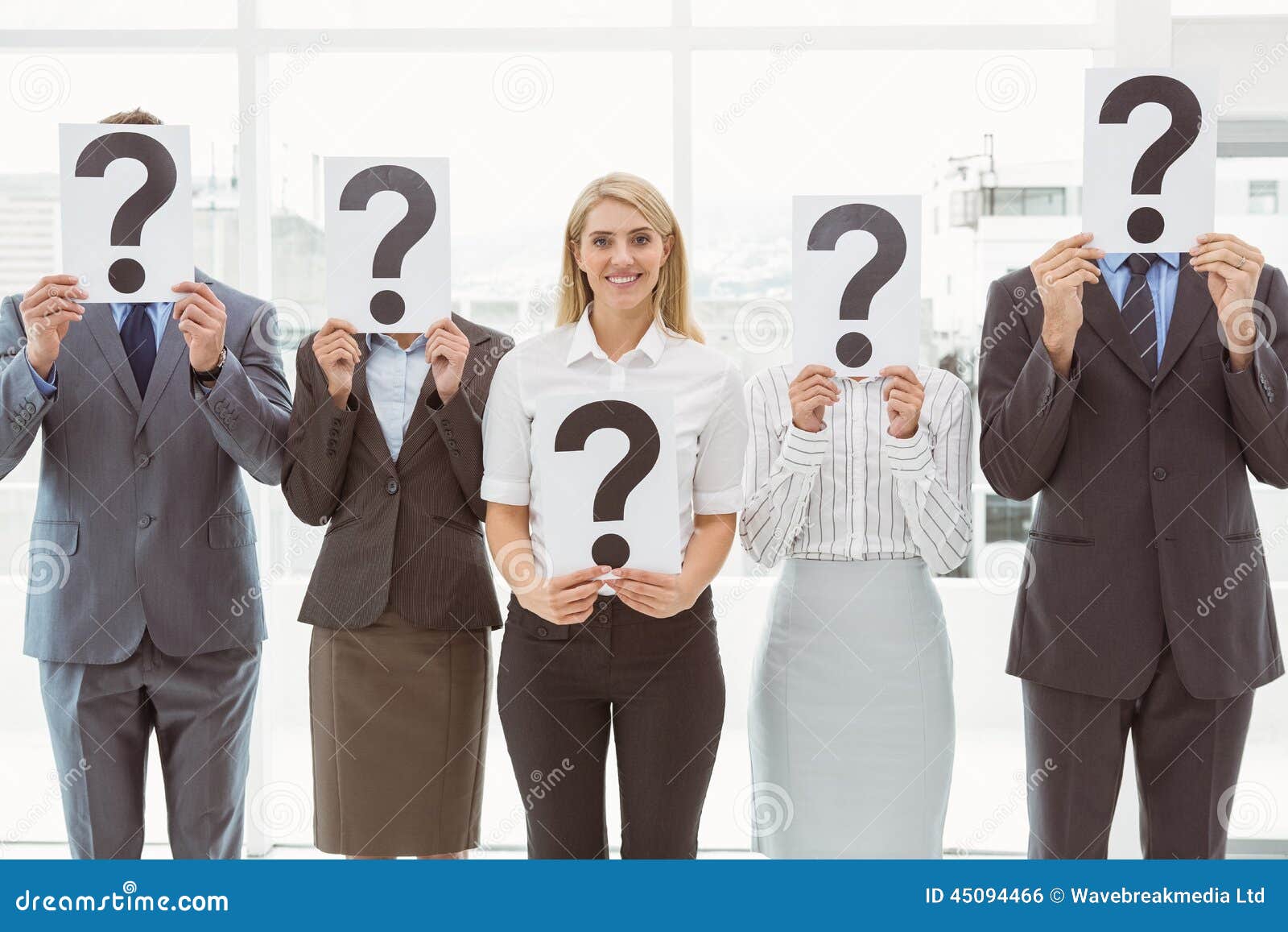 Business People Holding Question Mark Signs in Office Stock Photo ...