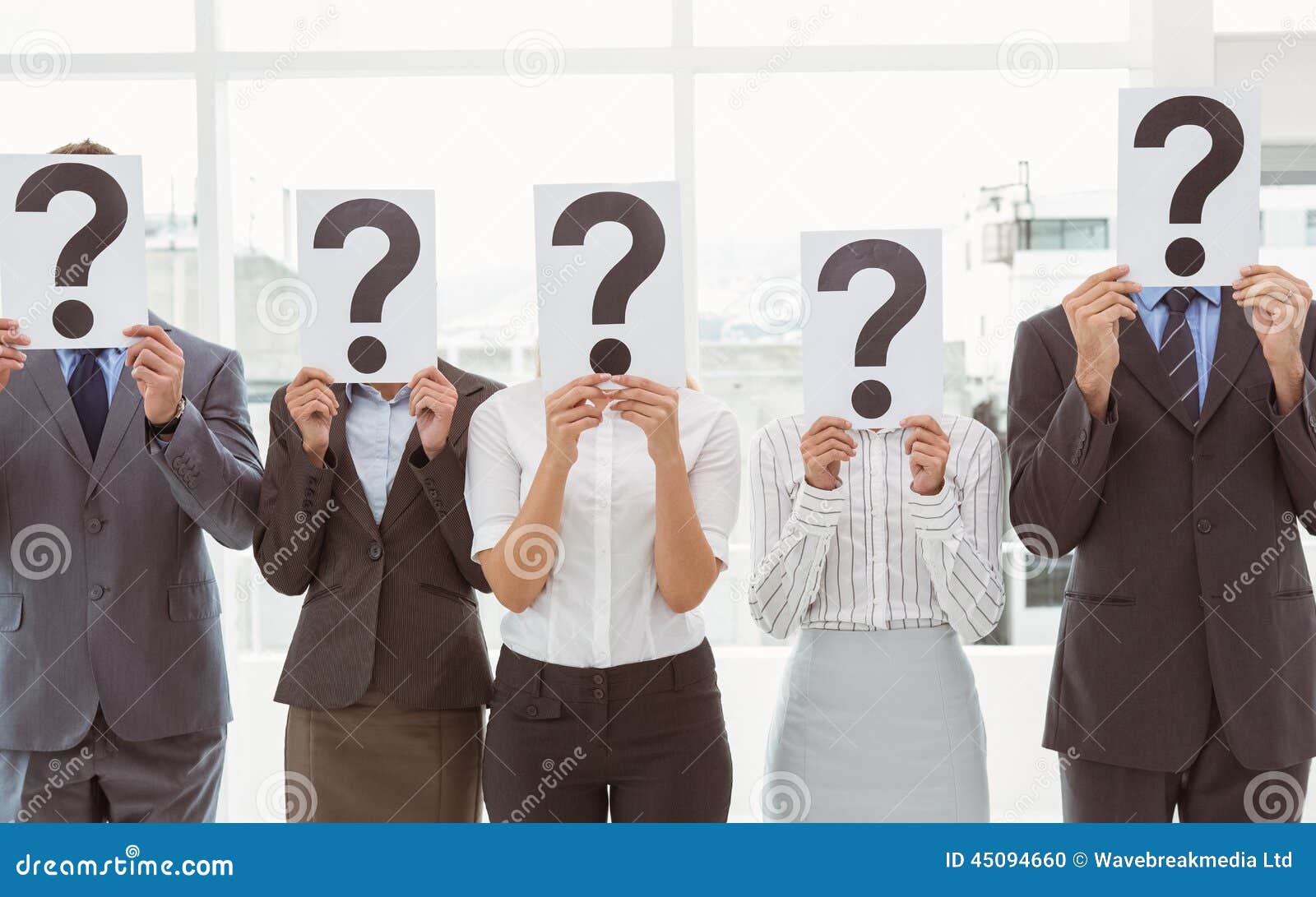 Business People Holding Question Mark Signs in Office Stock Photo ...