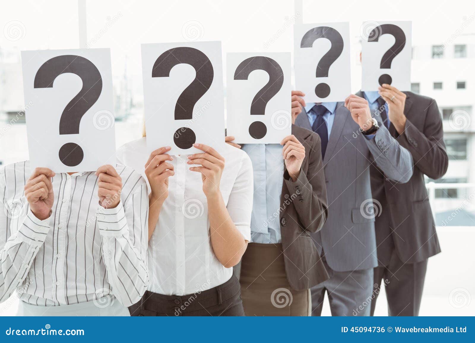 Business People Holding Question Mark Signs in Office Stock Photo ...