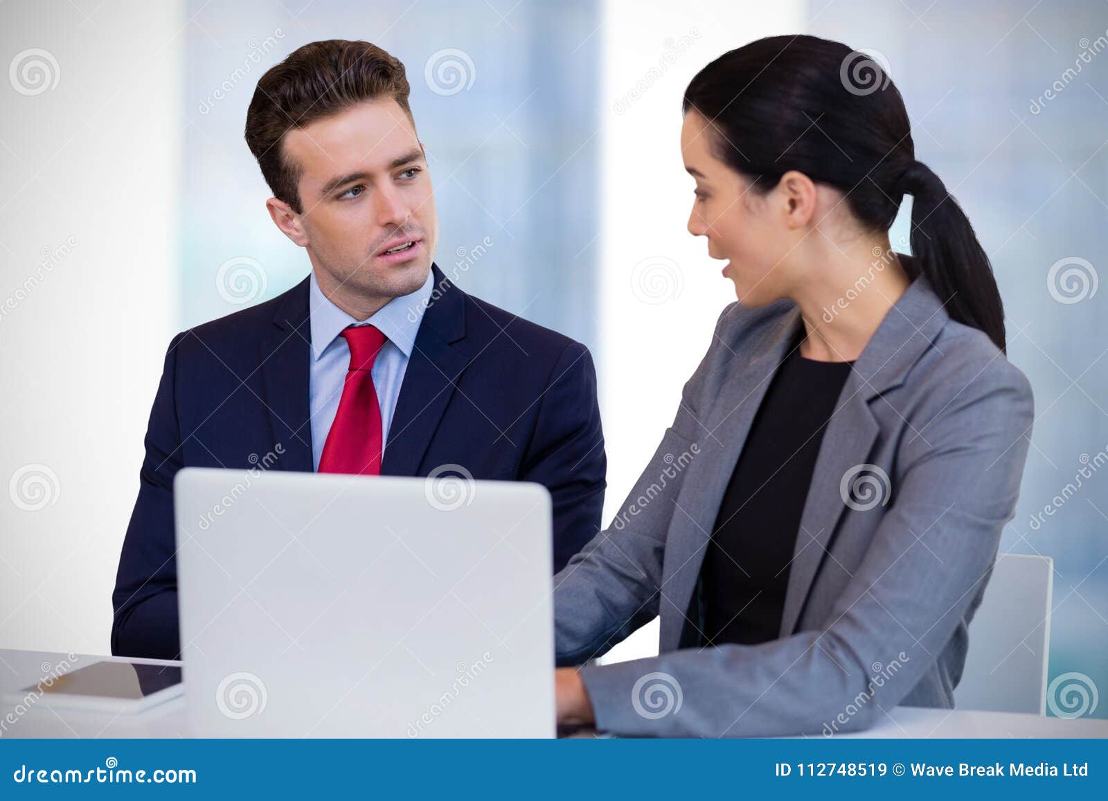 Composite Image of Business People Interacting Against White Background ...