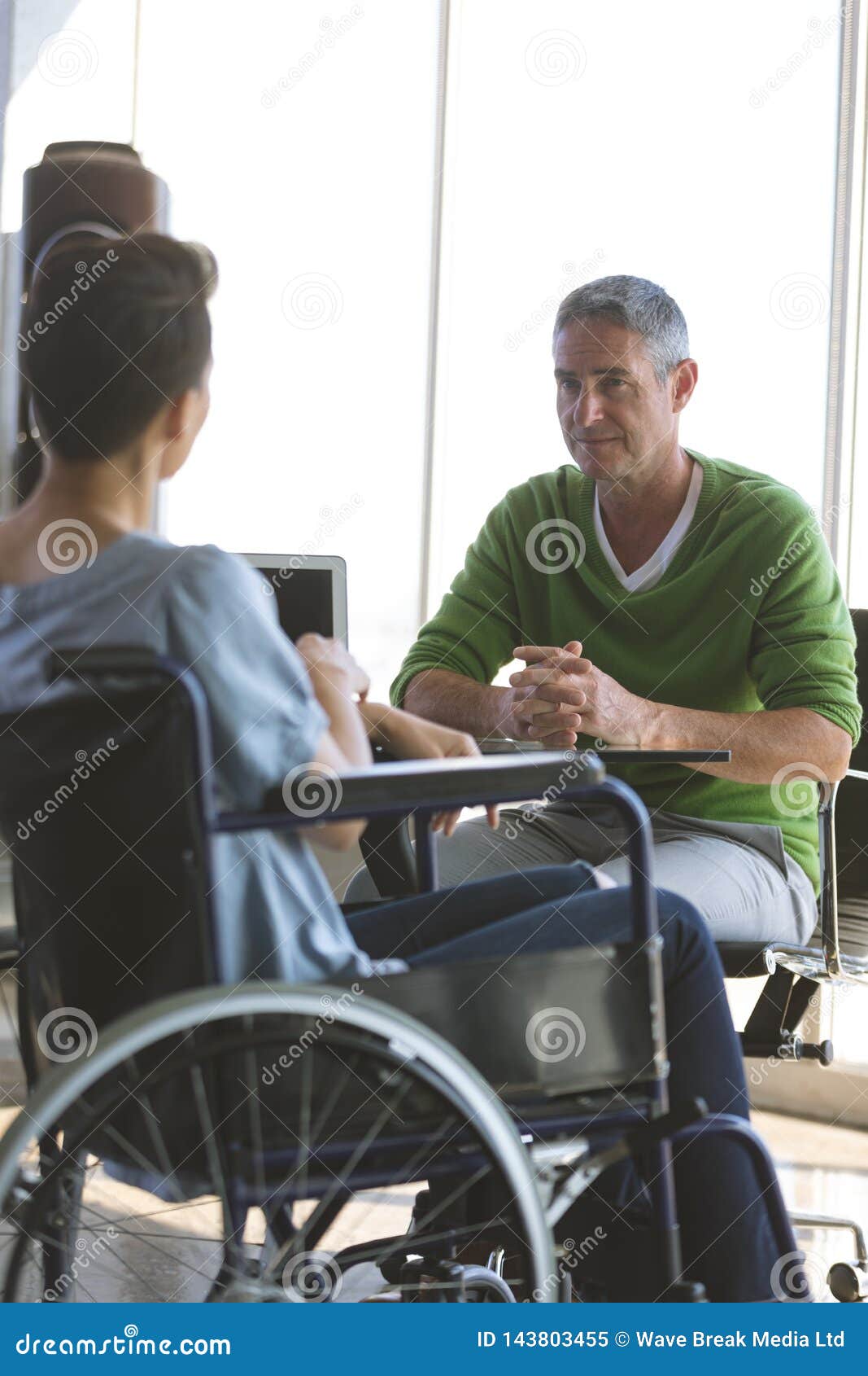 Business People Interacting with Each Other at Desk Stock Image - Image ...