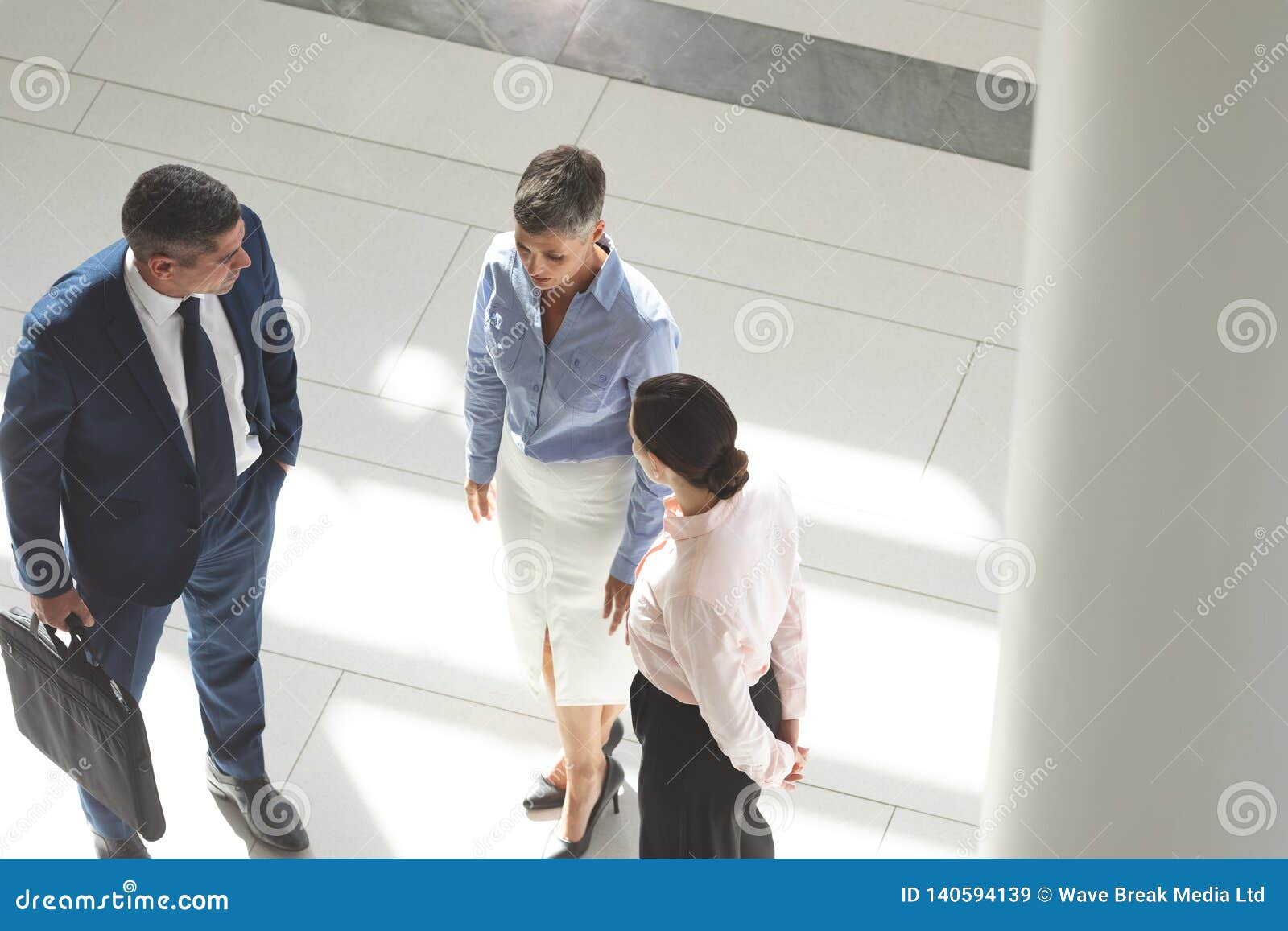 Business People Interacting with Each Other in Lobby Office Stock Image ... Business People Interacting with Each Other in Lobby Office Stock Image ...