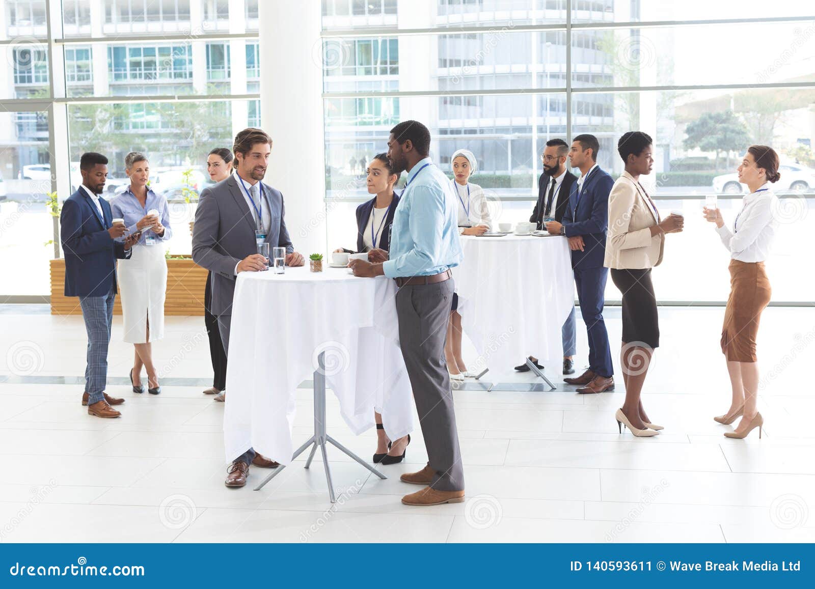 Business People Interacting with Each Other at Table during a Seminar ...