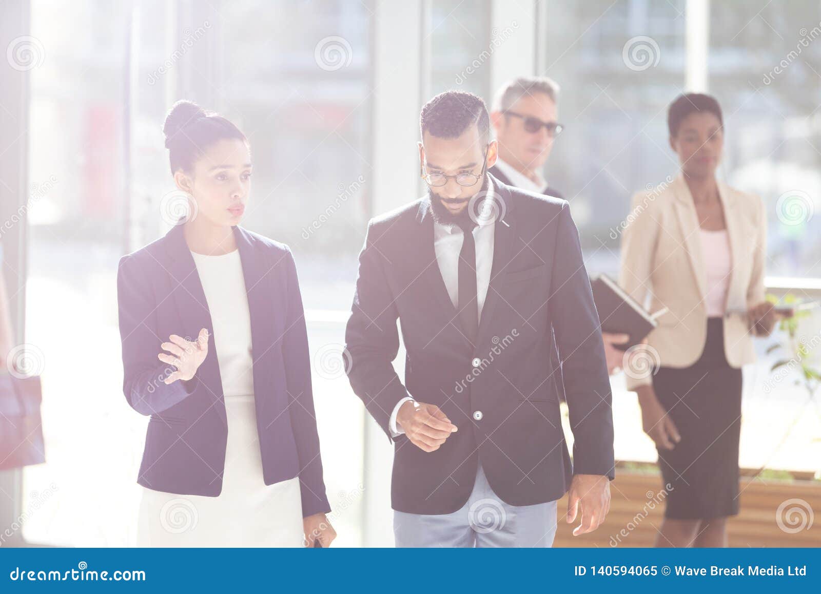 Business People Interacting with Each Others in Office Lobby Stock ...