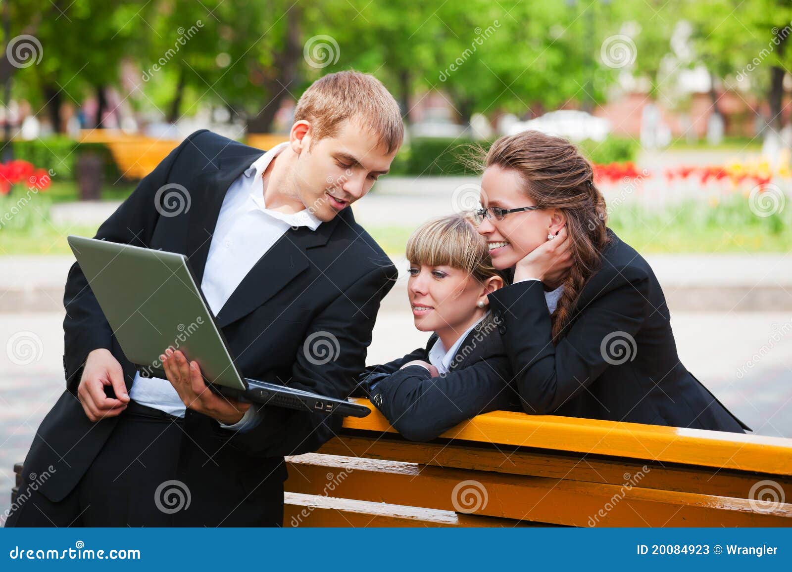 Young Business People Using Laptop in City Park Stock Image - Image of ...