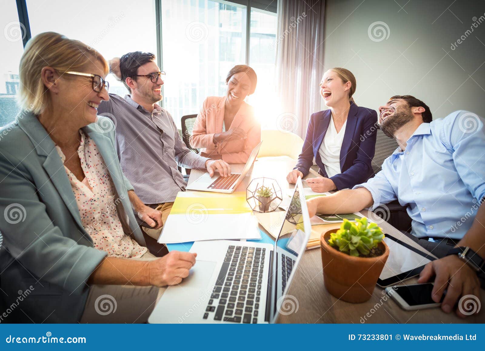 Business People Laughing during a Meeting Stock Image - Image of ...