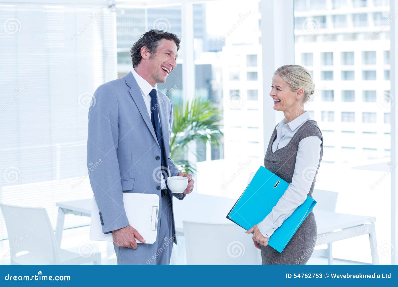 Business People Laughing in an Office Stock Image - Image of laughing ...
