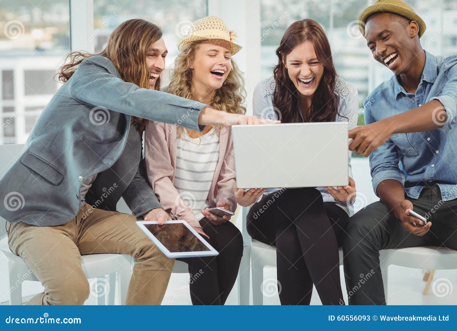 Business People Laughing while Pointing at Laptop Stock Image - Image ...