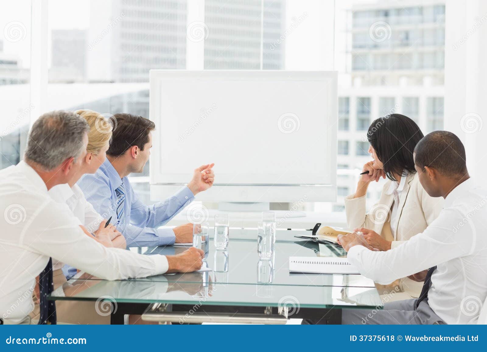 Business People Looking at Blank Whiteboard in Conference Room Stock ...