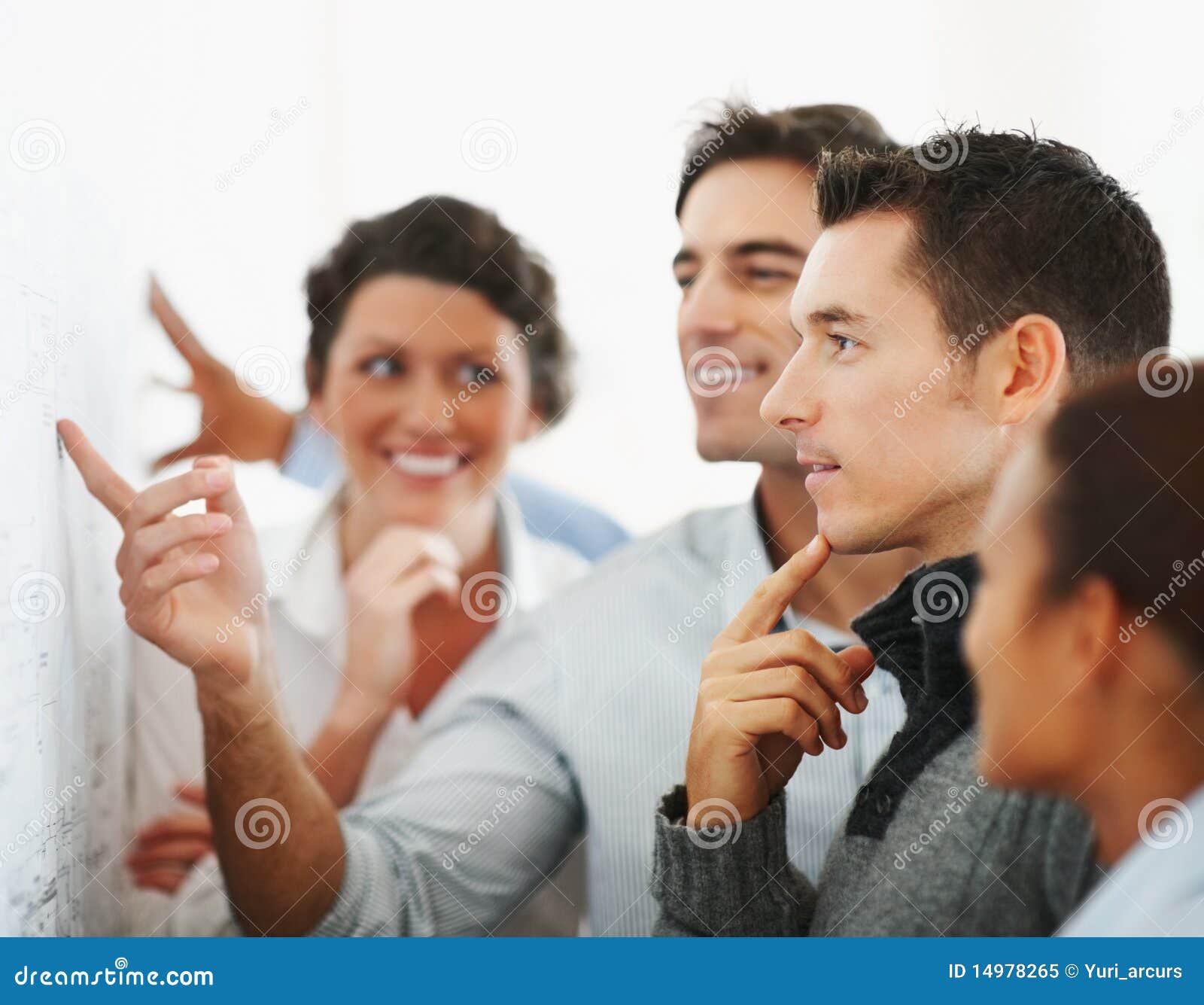 Business People Looking at a Chart Put on the Wall Stock Image - Image ...