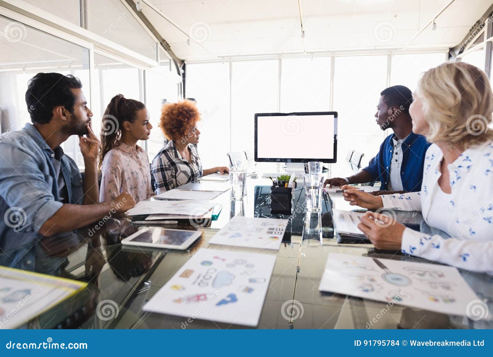 Business People Looking at Digital Screen during Meeting Stock Photo ...
