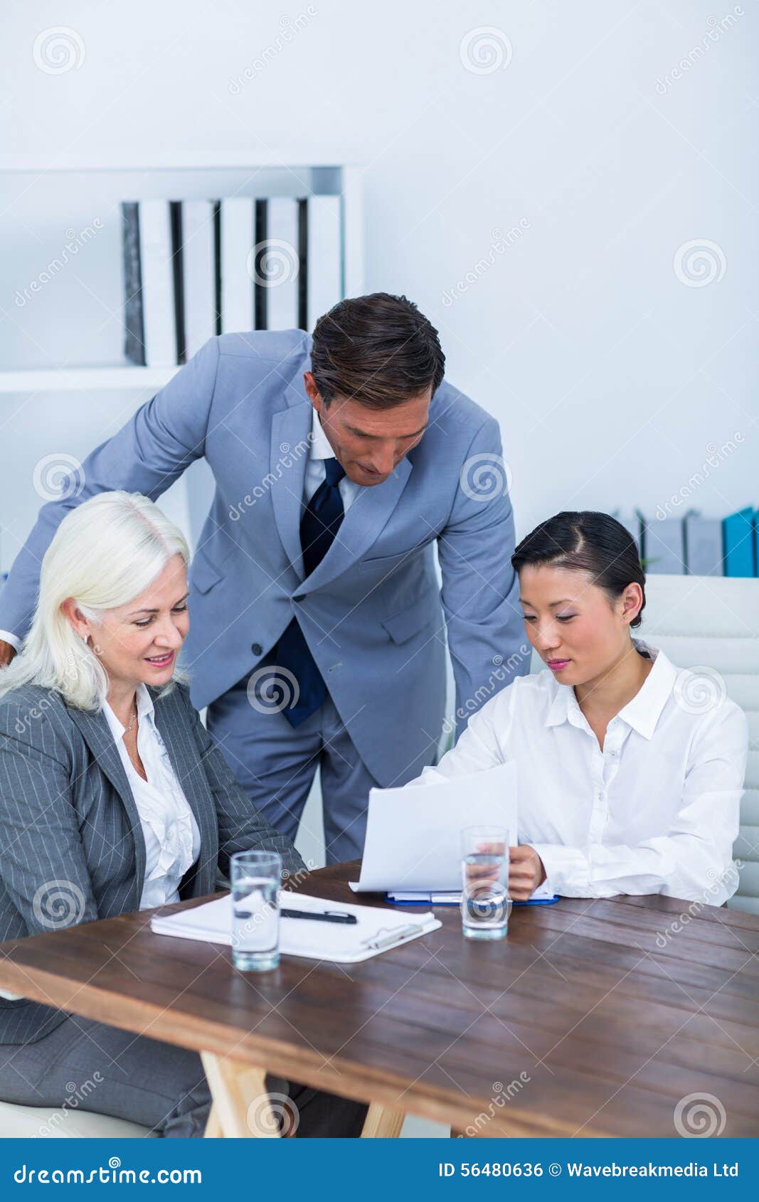 Business People Looking at Documents Stock Photo - Image of paper ...