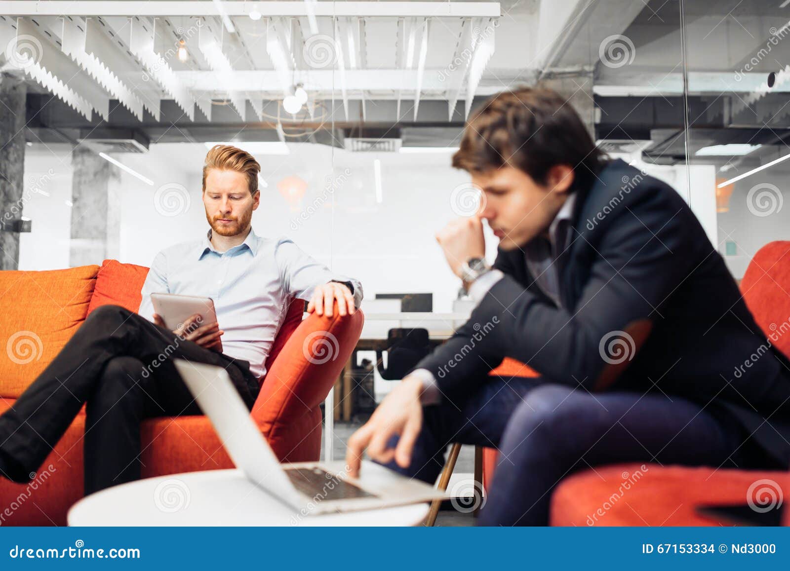 Business People Looking at Their Devices Stock Photo - Image of ...