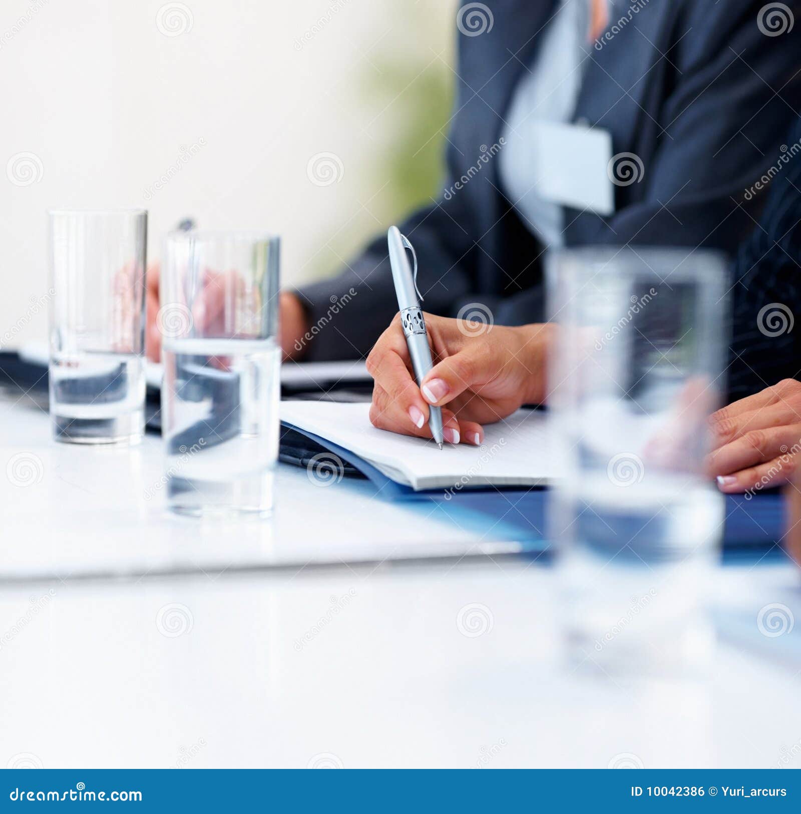 Business People Making a Note by Glass of Water Stock Photo - Image of ...