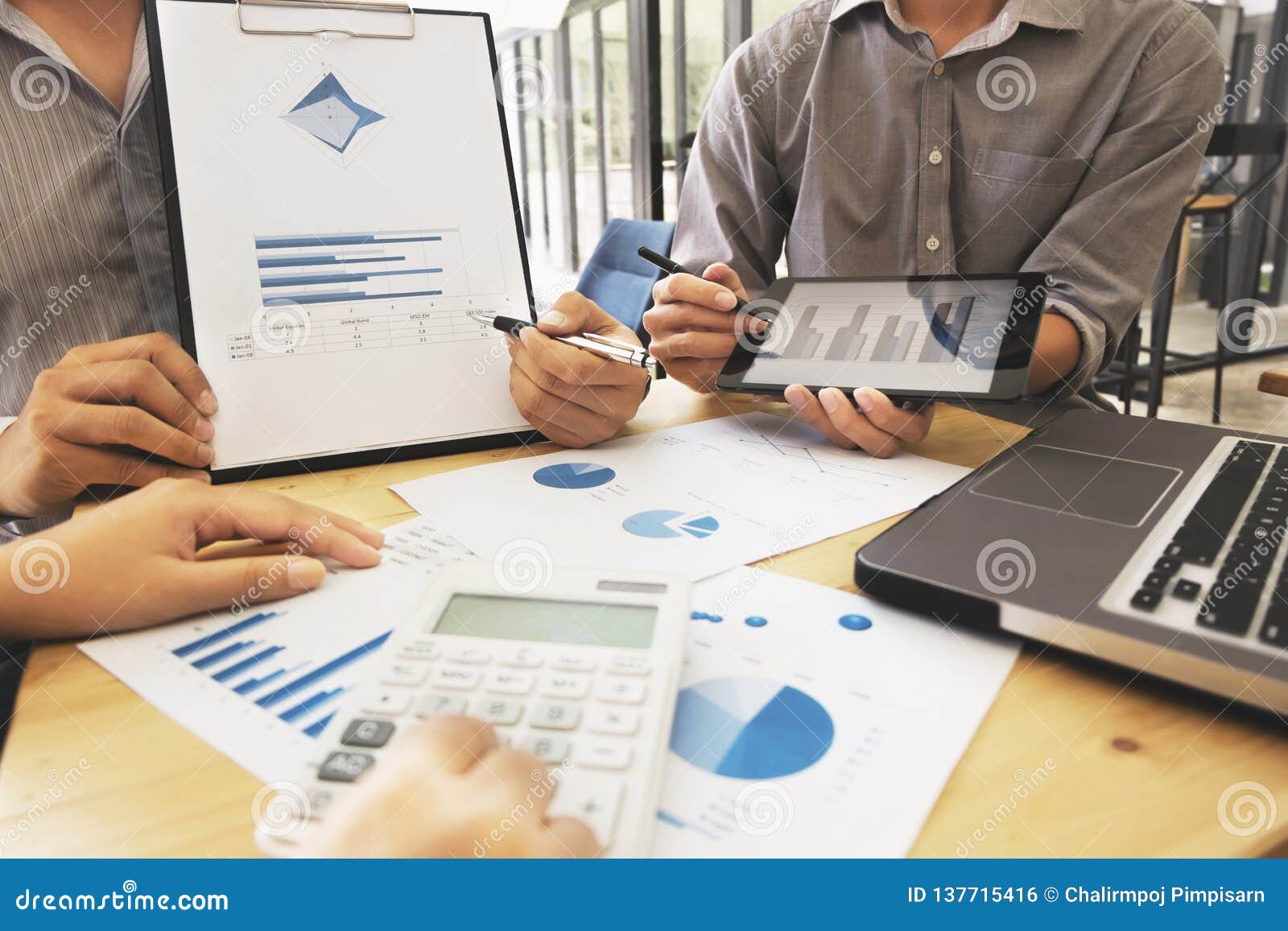 Business People Meeting Discussing on Digital Tablet with Data Graph ...