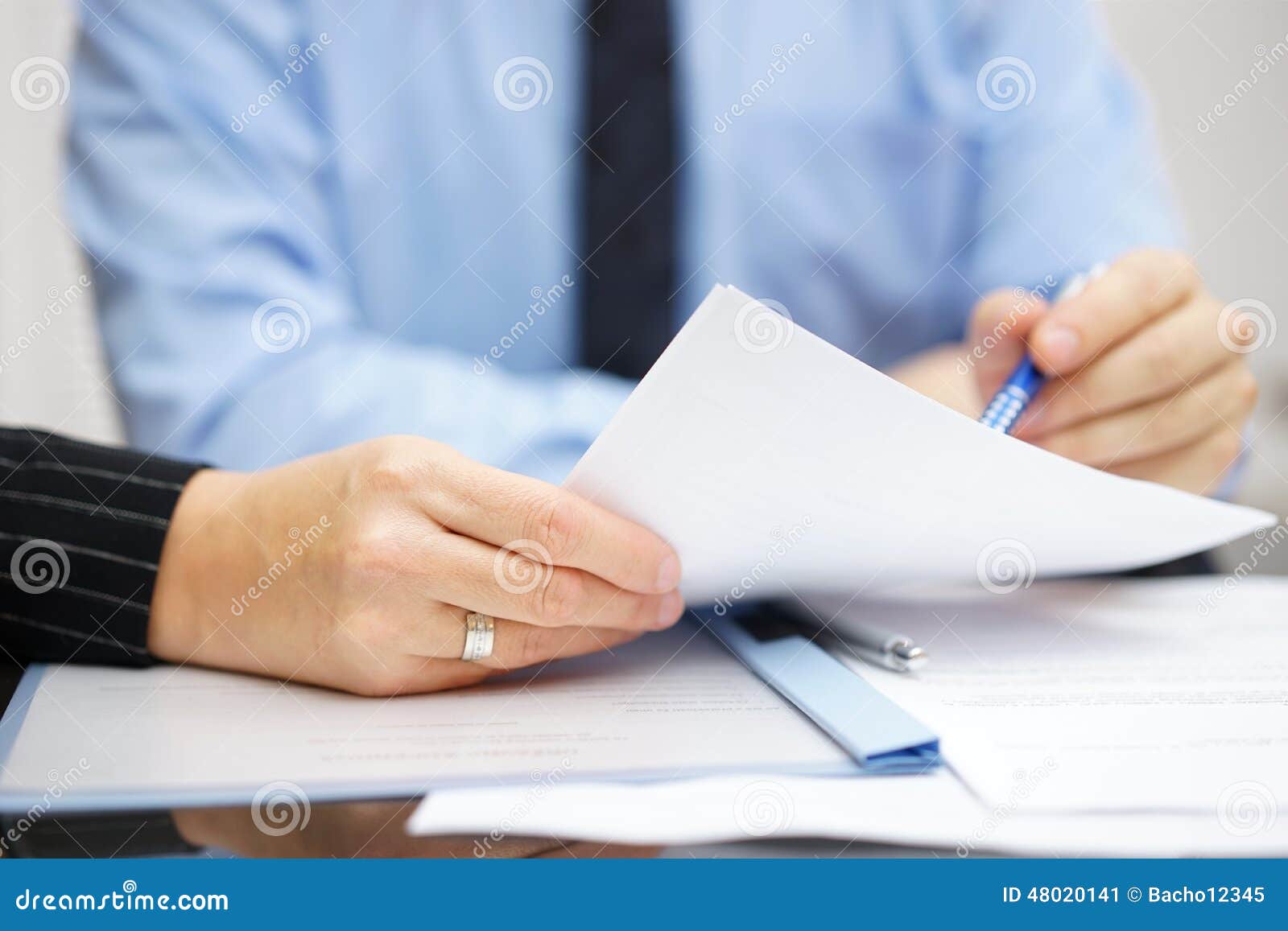 Business People at the Office Discussing and Analyzing Document Stock ... Business People at the Office Discussing and Analyzing Document Stock ...