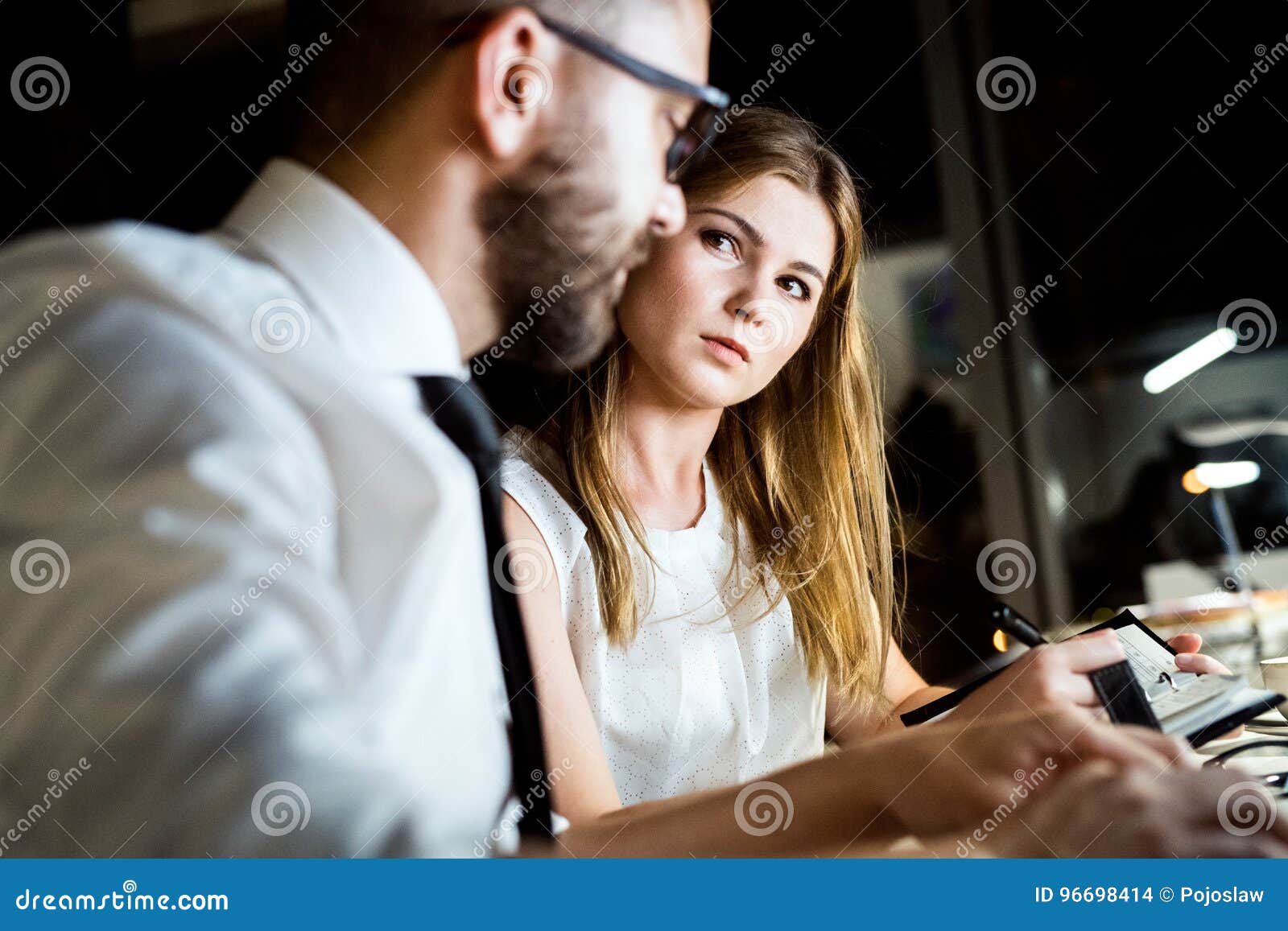 Business People in the Office at Night Working Late. Stock Photo ...