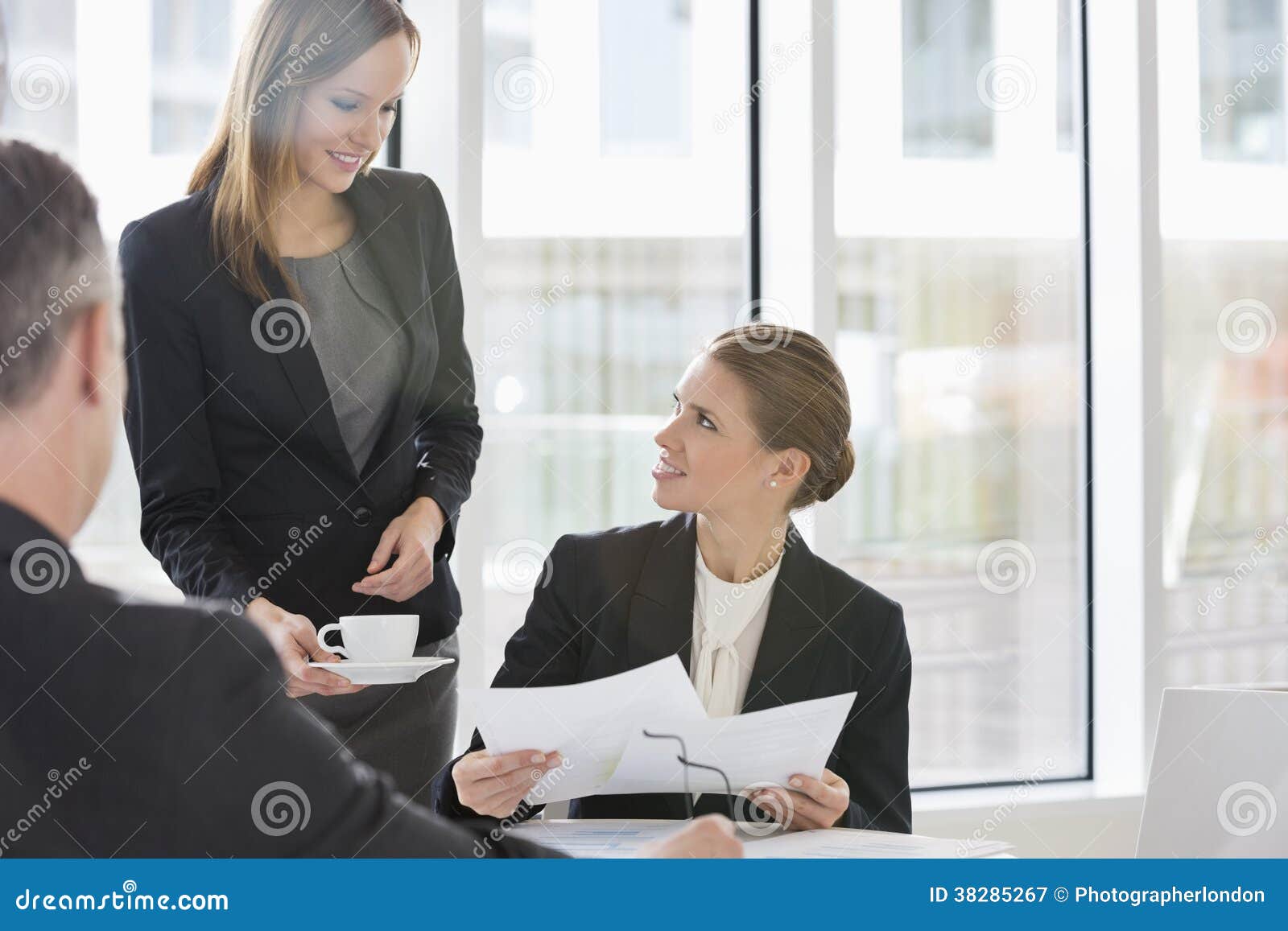 Business People with Paperwork during Coffee Break Stock Image - Image ...