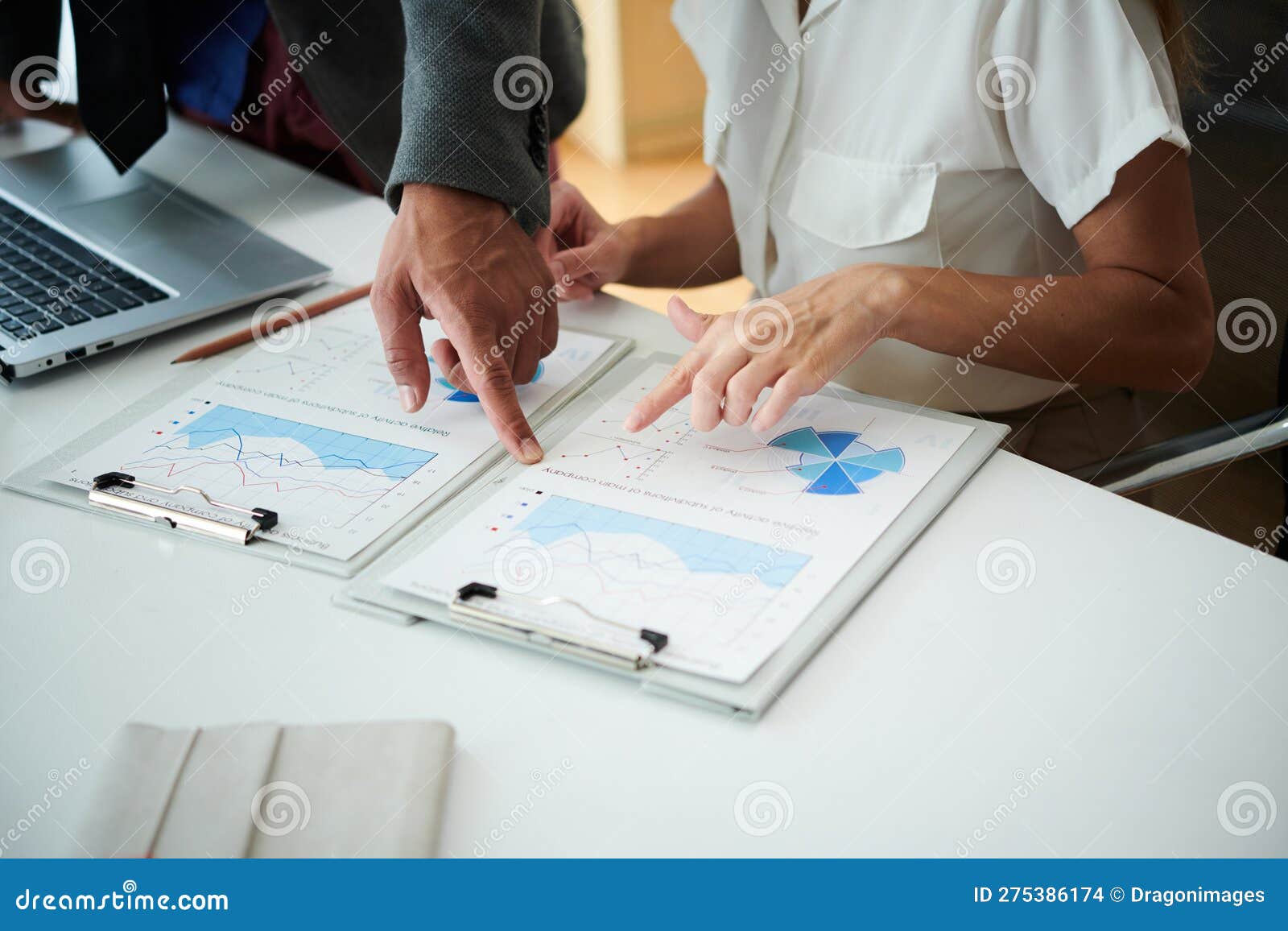 Business People Pointing at Chart Stock Photo - Image of document ...