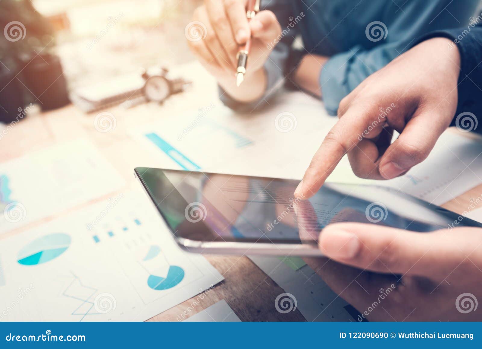 Business People Pointing Chart on Tablet Screen with Analysis To Stock ...