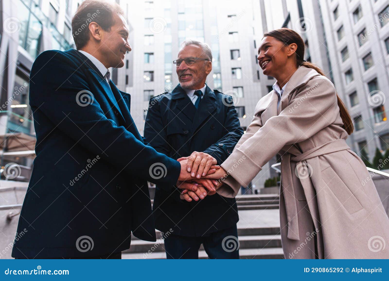 Business People Putting Their Hands Together As Teamwork and Partner ...