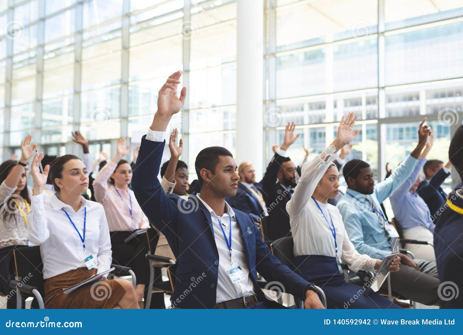 Business People Raising Hands in Business Seminar Stock Photo - Image ...