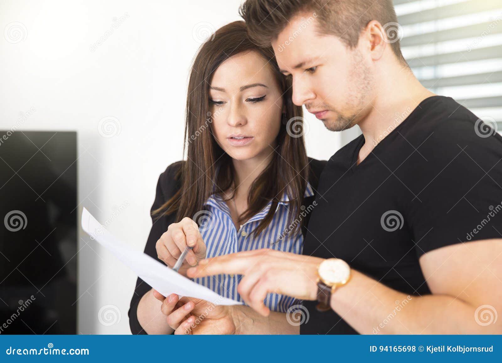 Business People Reading Document in Office Stock Photo - Image of ...