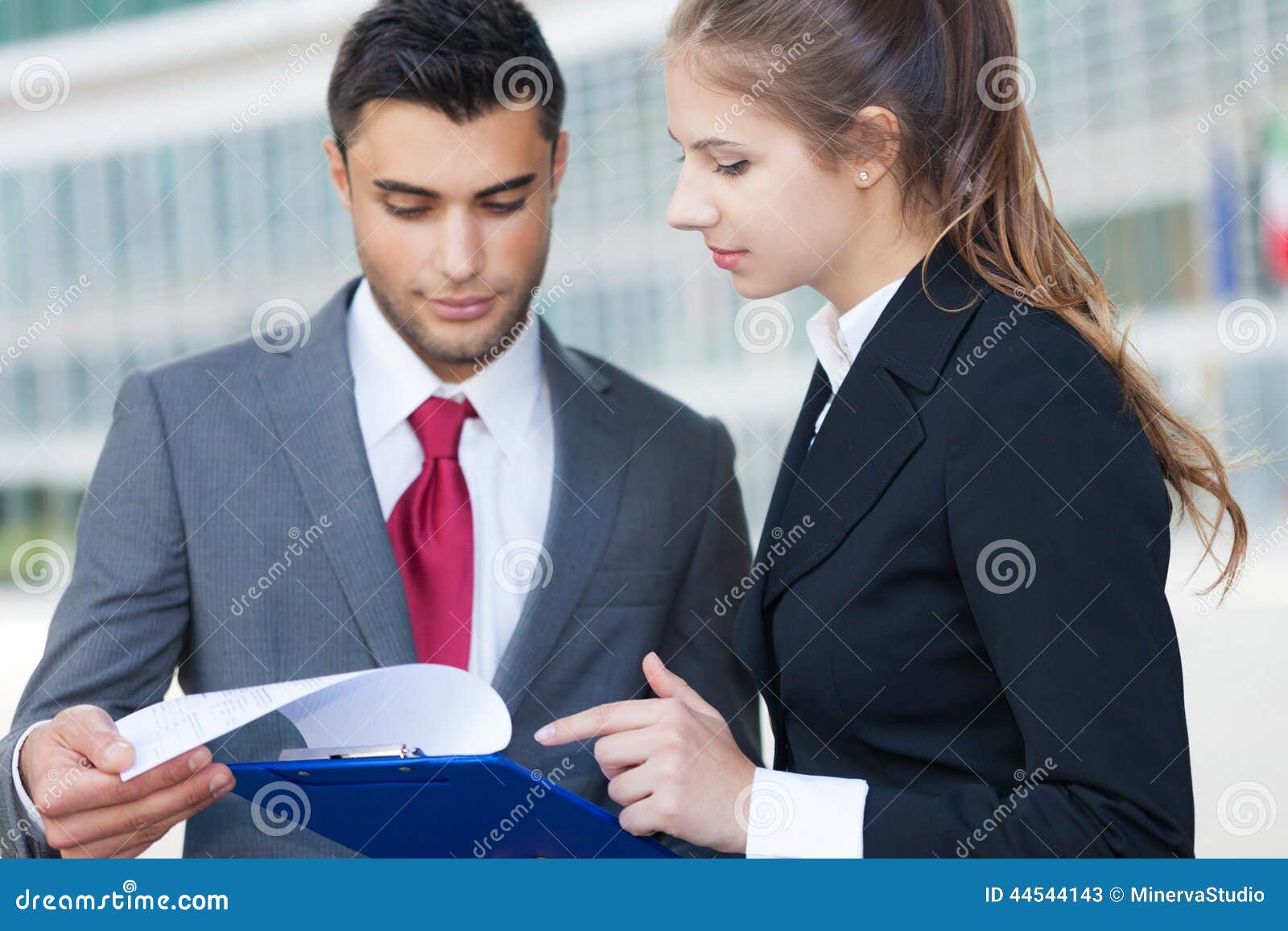 Business People Reading a Document Stock Image - Image of female ...