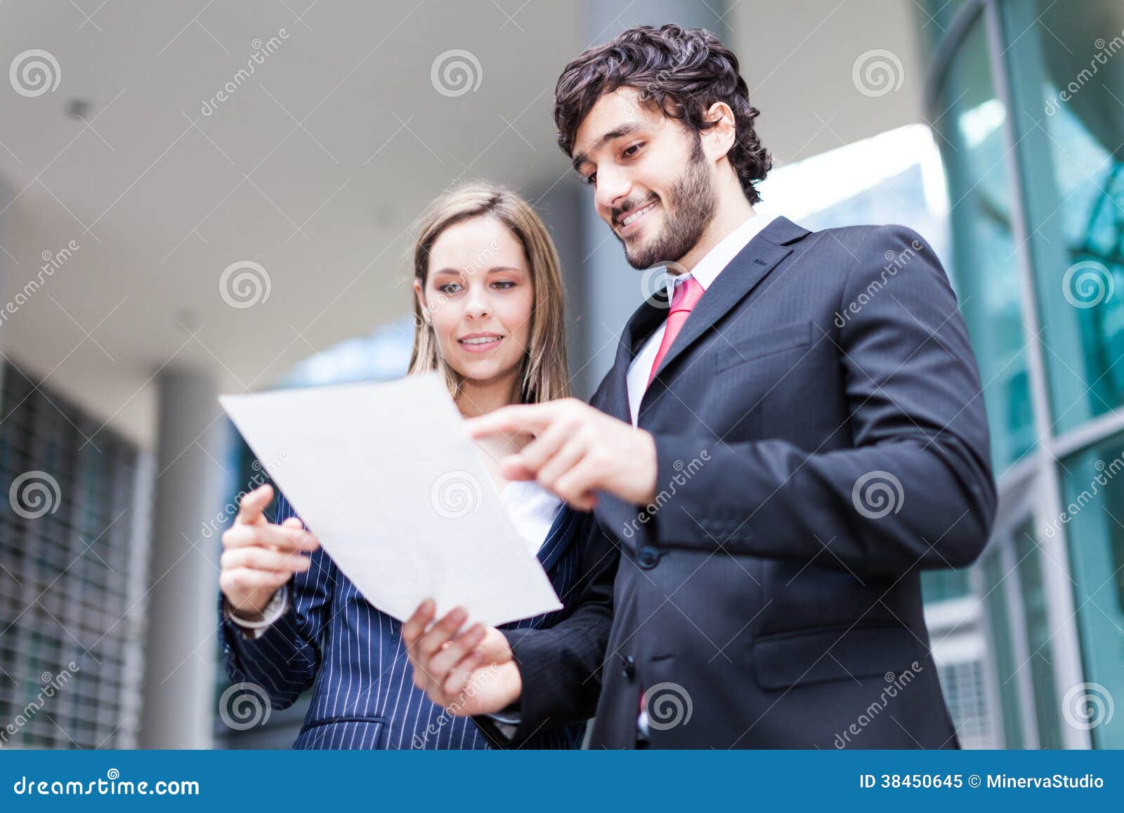 Business People Reading a Document Stock Image - Image of outdoor ...
