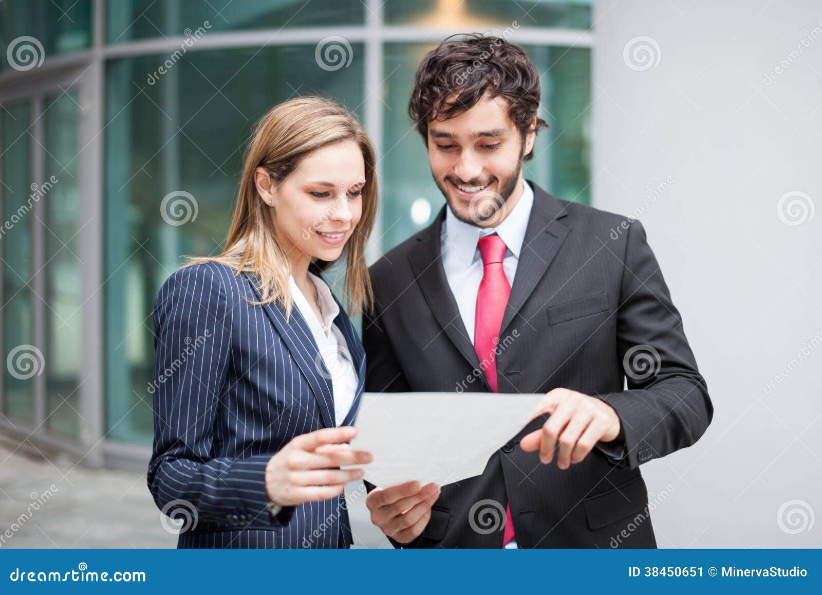 Business People Reading a Document Stock Image - Image of company ...