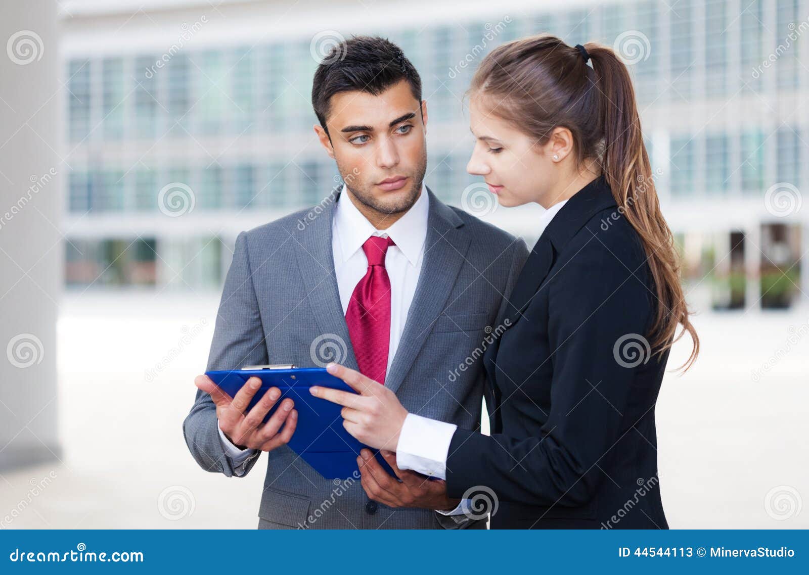 Business People Reading a Document Stock Image - Image of colleagues ...