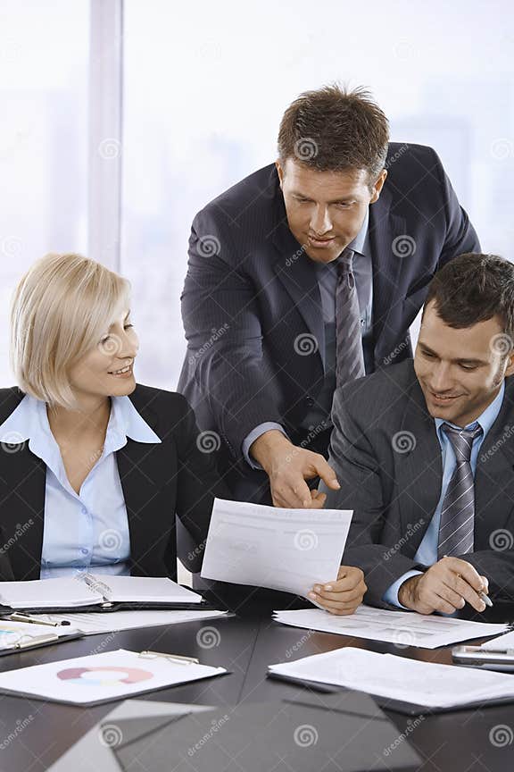 Business People Reviewing Documents Stock Photo - Image of boardroom ...