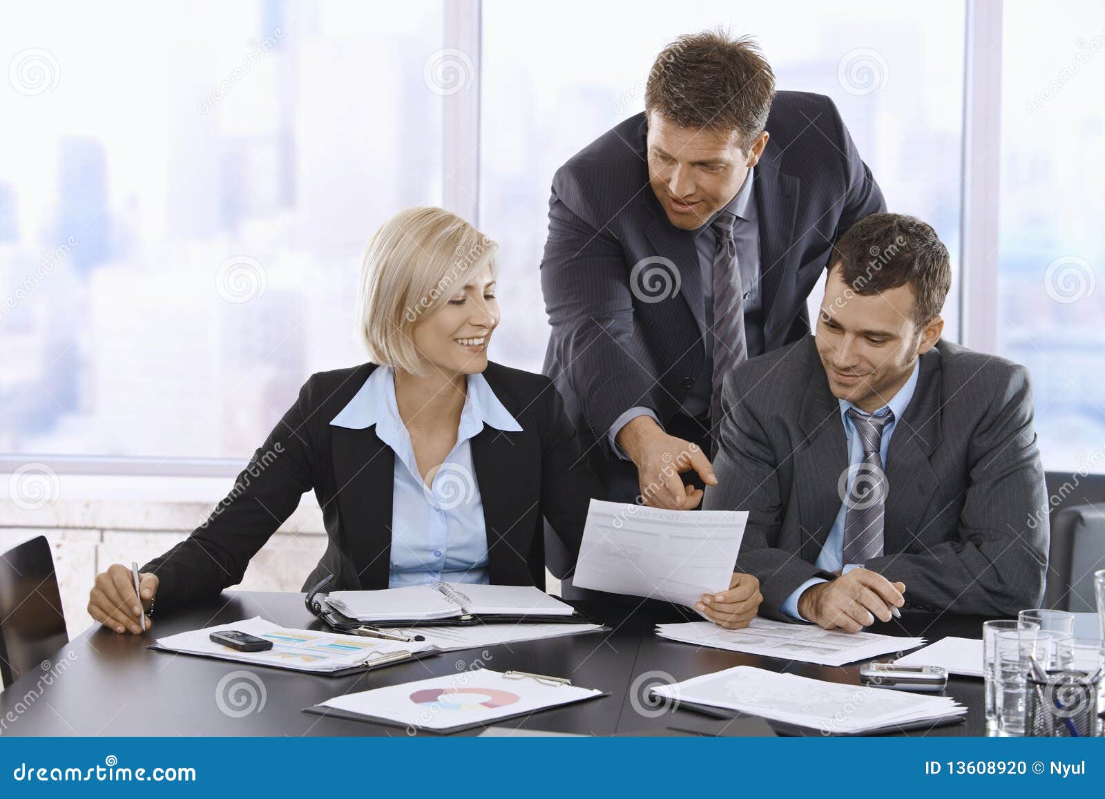 Business People Reviewing Documents Stock Photo - Image of businessman ...