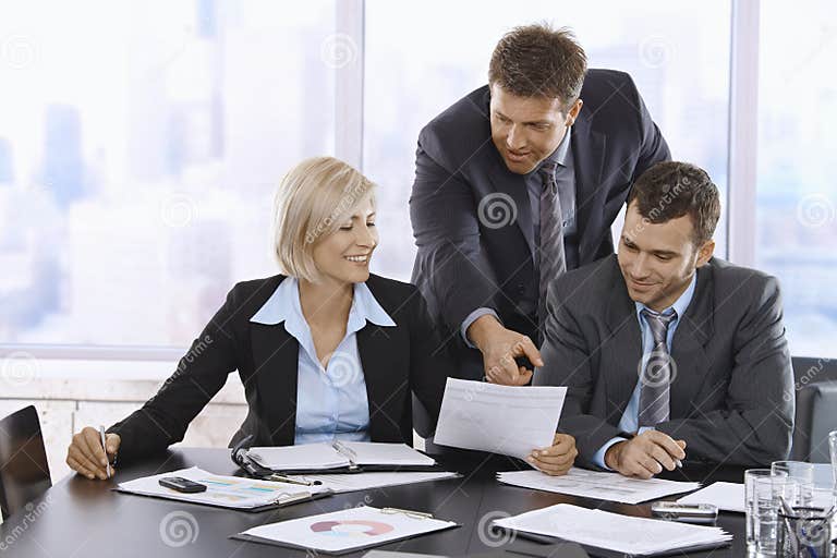 Business People Reviewing Documents Stock Photo - Image of businessman ...